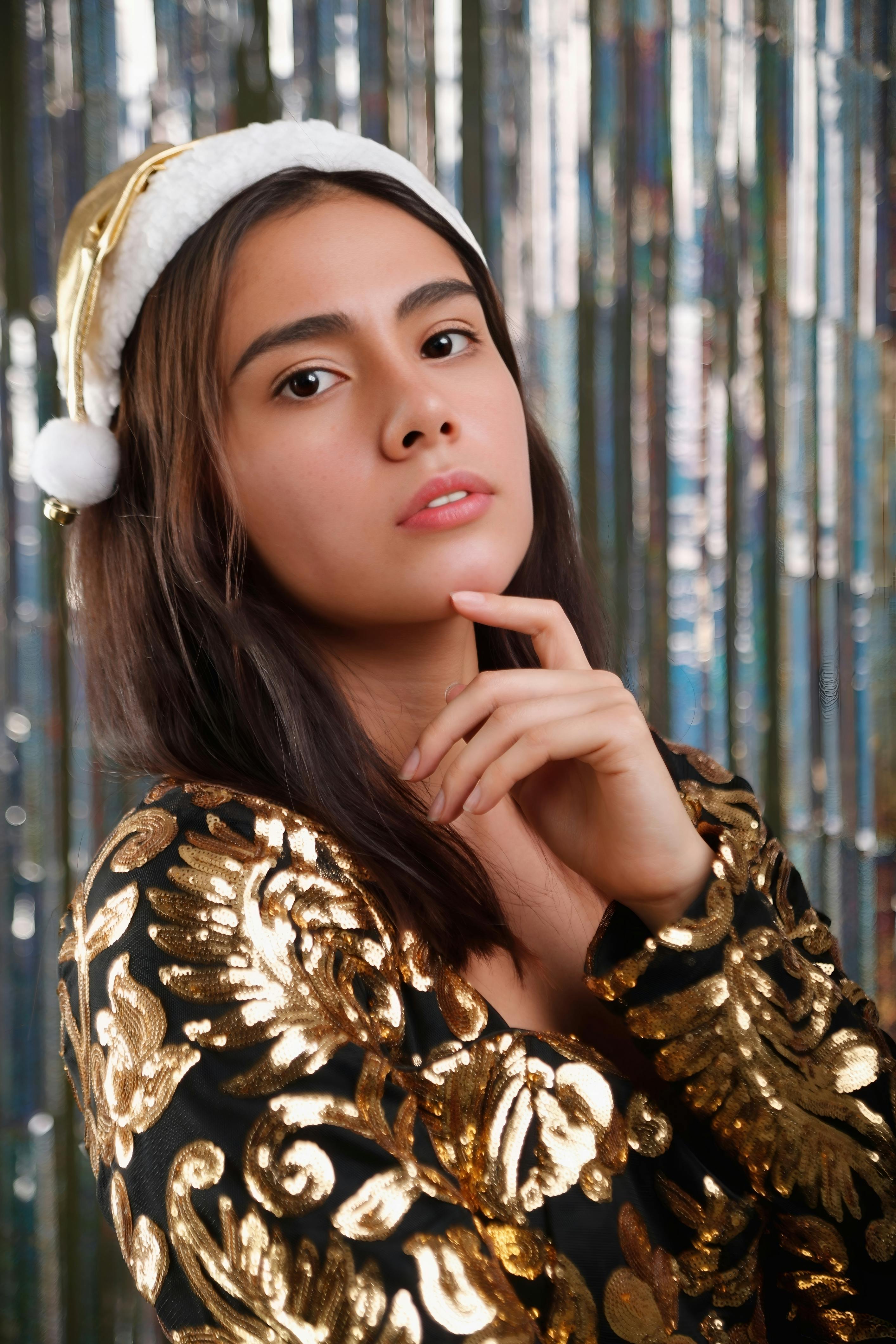 Festive Portrait of a Young Woman in Holiday Attire · Free Stock Photo