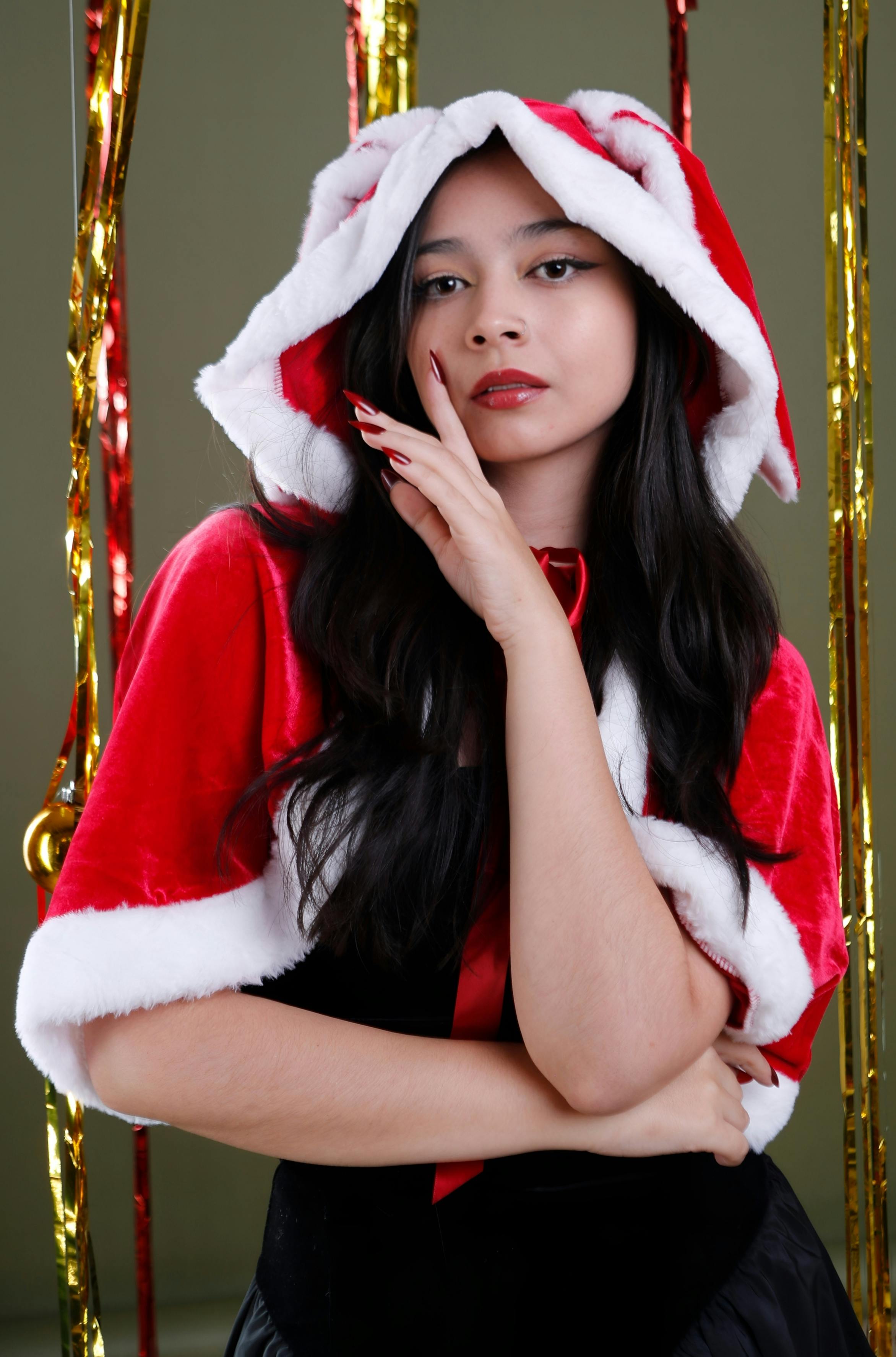 Festive Portrait of Woman in Santa Costume · Free Stock Photo