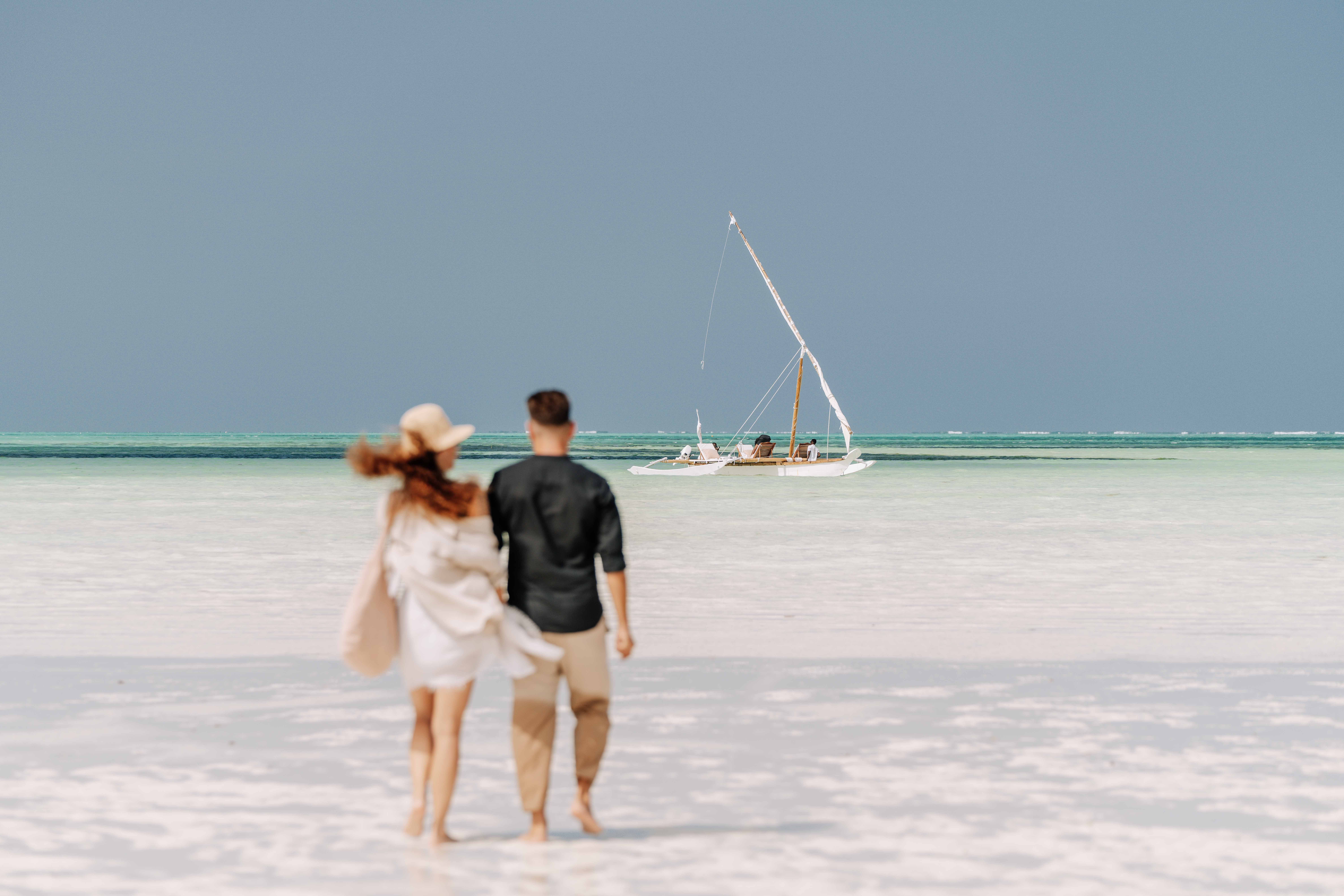 Romantic Beach Walk with Dhow in Zanzibar · Free Stock Photo