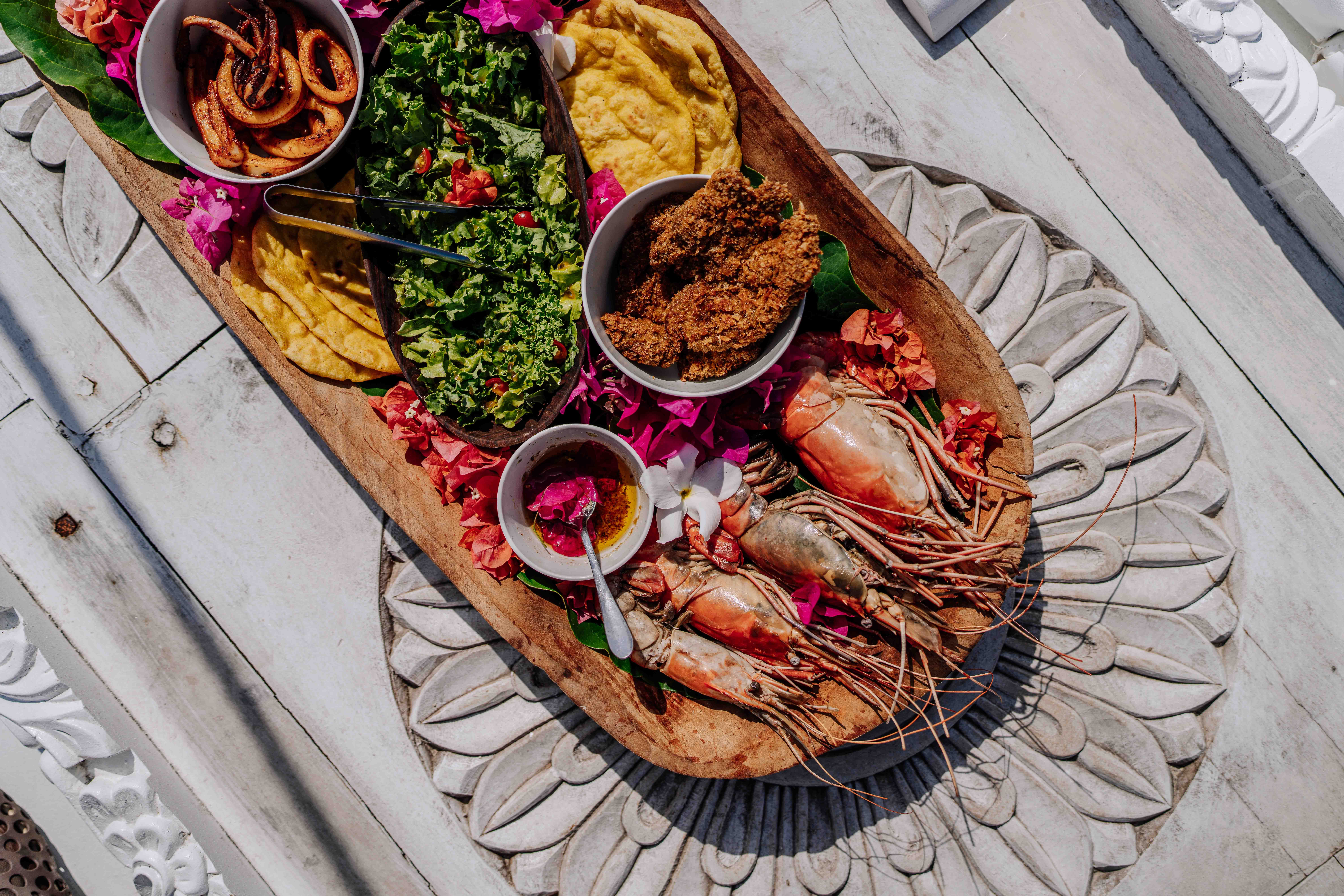 Traditional Zanzibar Seafood Platter on Decorative Table · Free Stock Photo