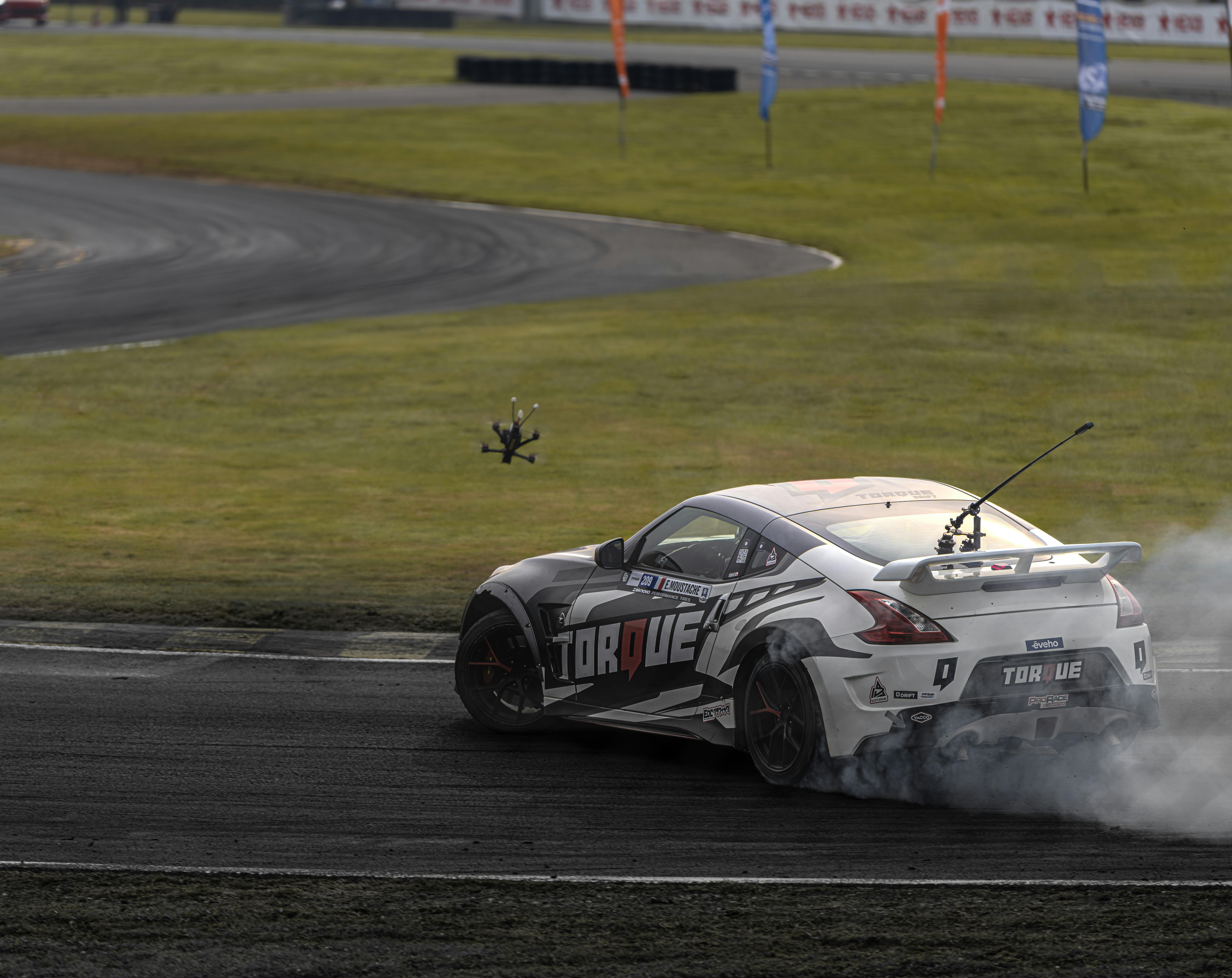 High-Speed Drift Car on a Racing Track · Free Stock Photo
