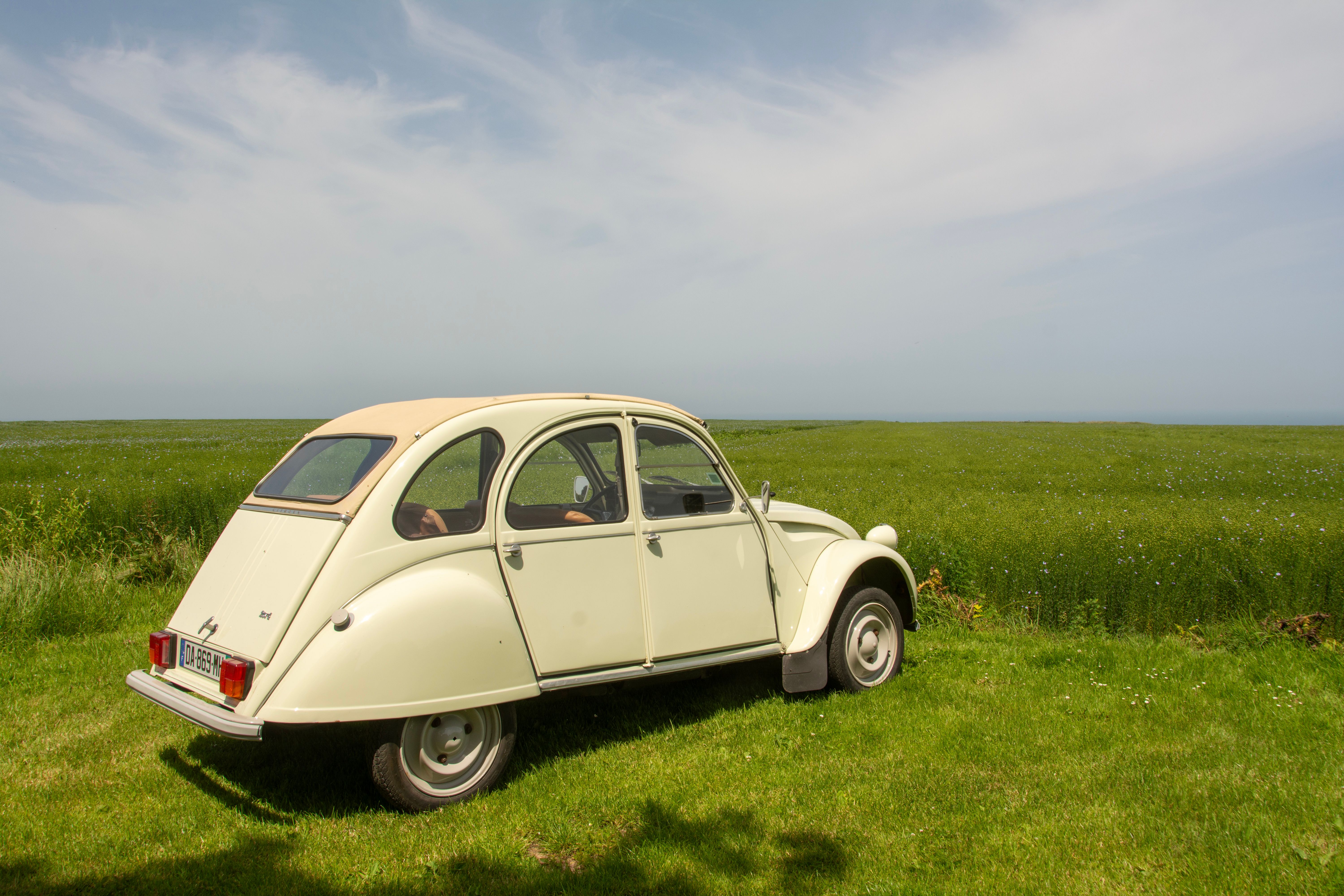 Classic vintage car in serene countryside landscape · Free Stock Photo