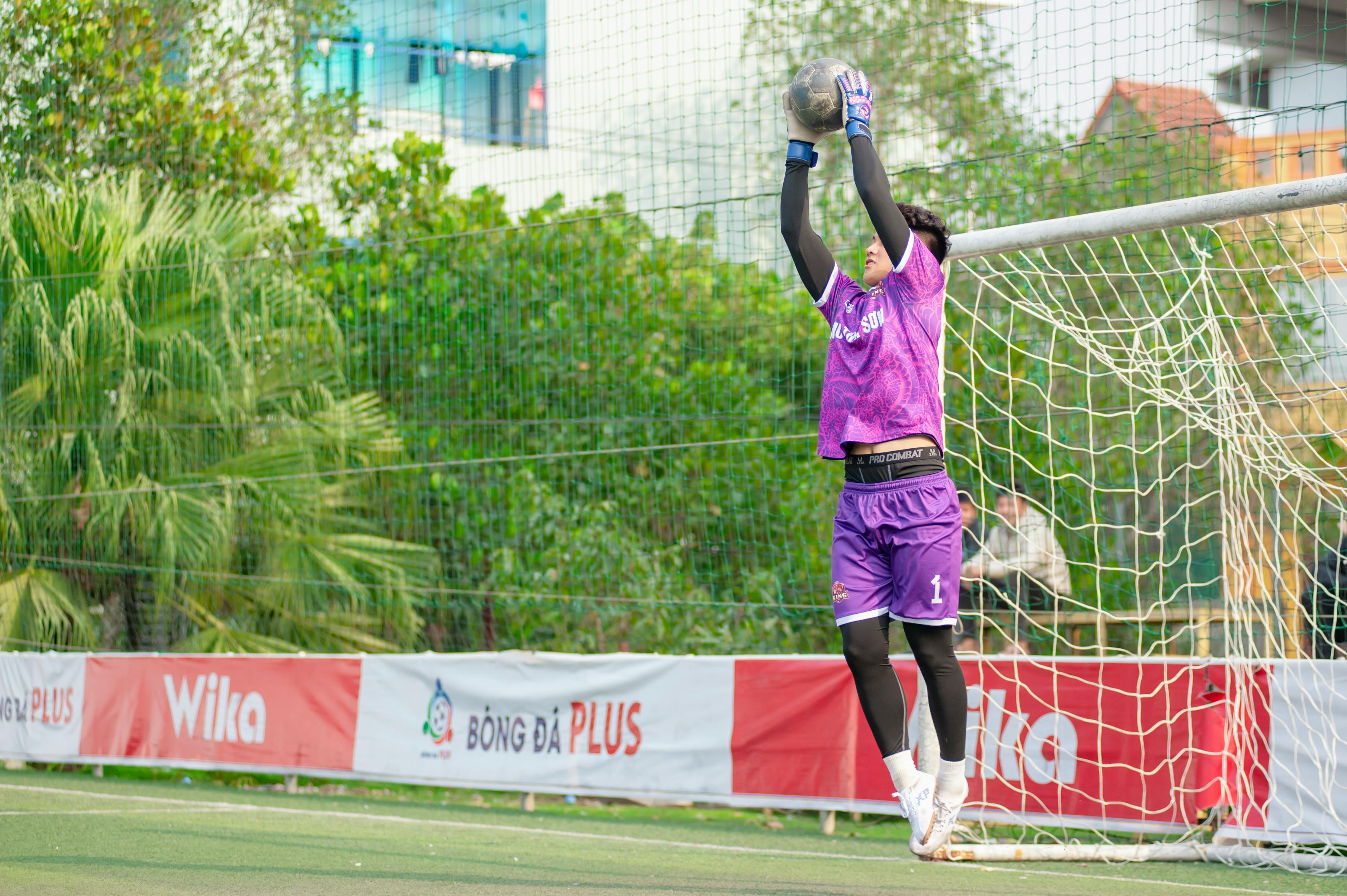 Goalkeeper Making a Save on Soccer Field in Hanoi · Free Stock Photo