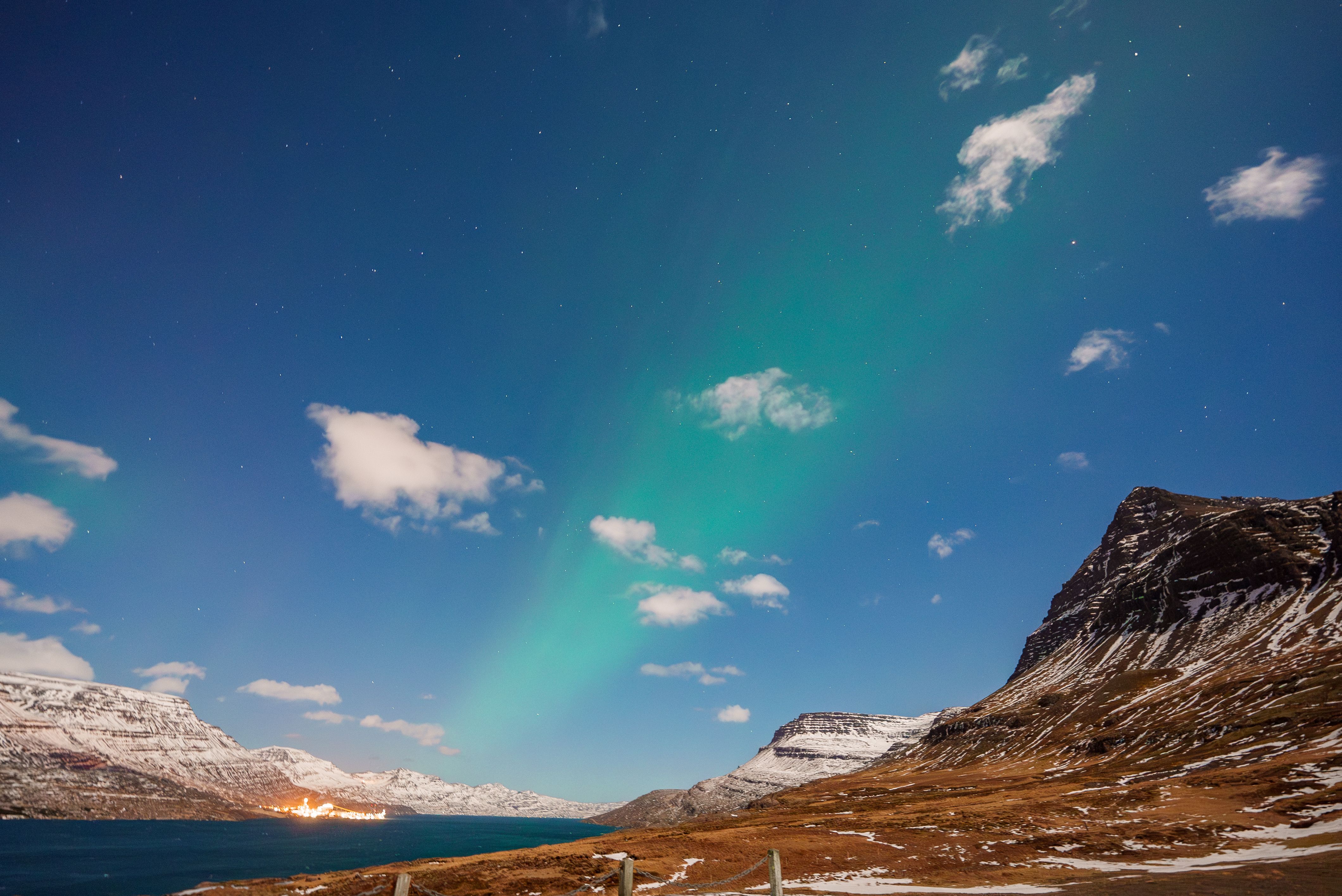 Stunning Aurora Borealis Over Snowy Mountain Landscape · Free Stock Photo