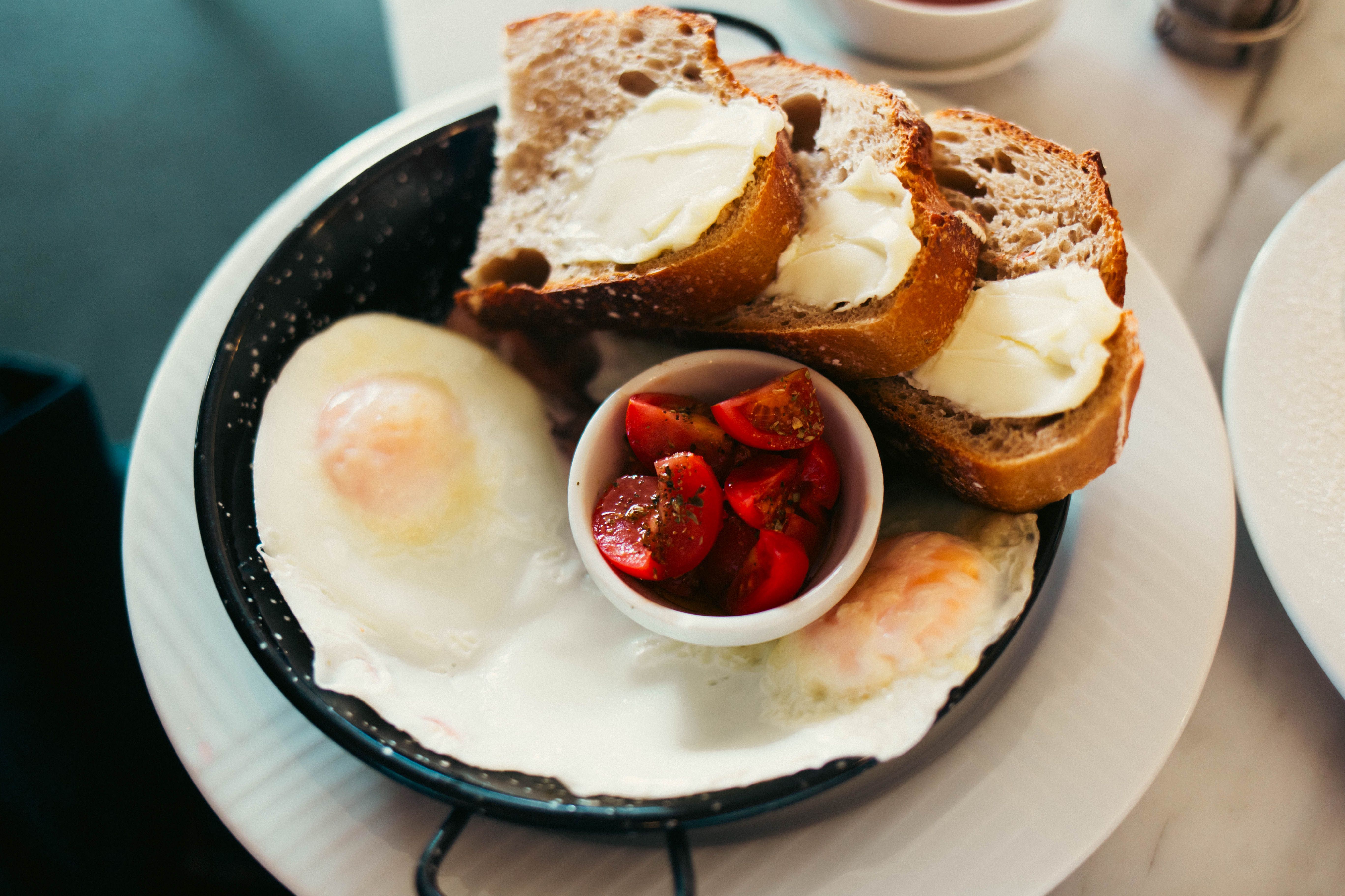Delicious Breakfast with Bread and Eggs Dish · Free Stock Photo