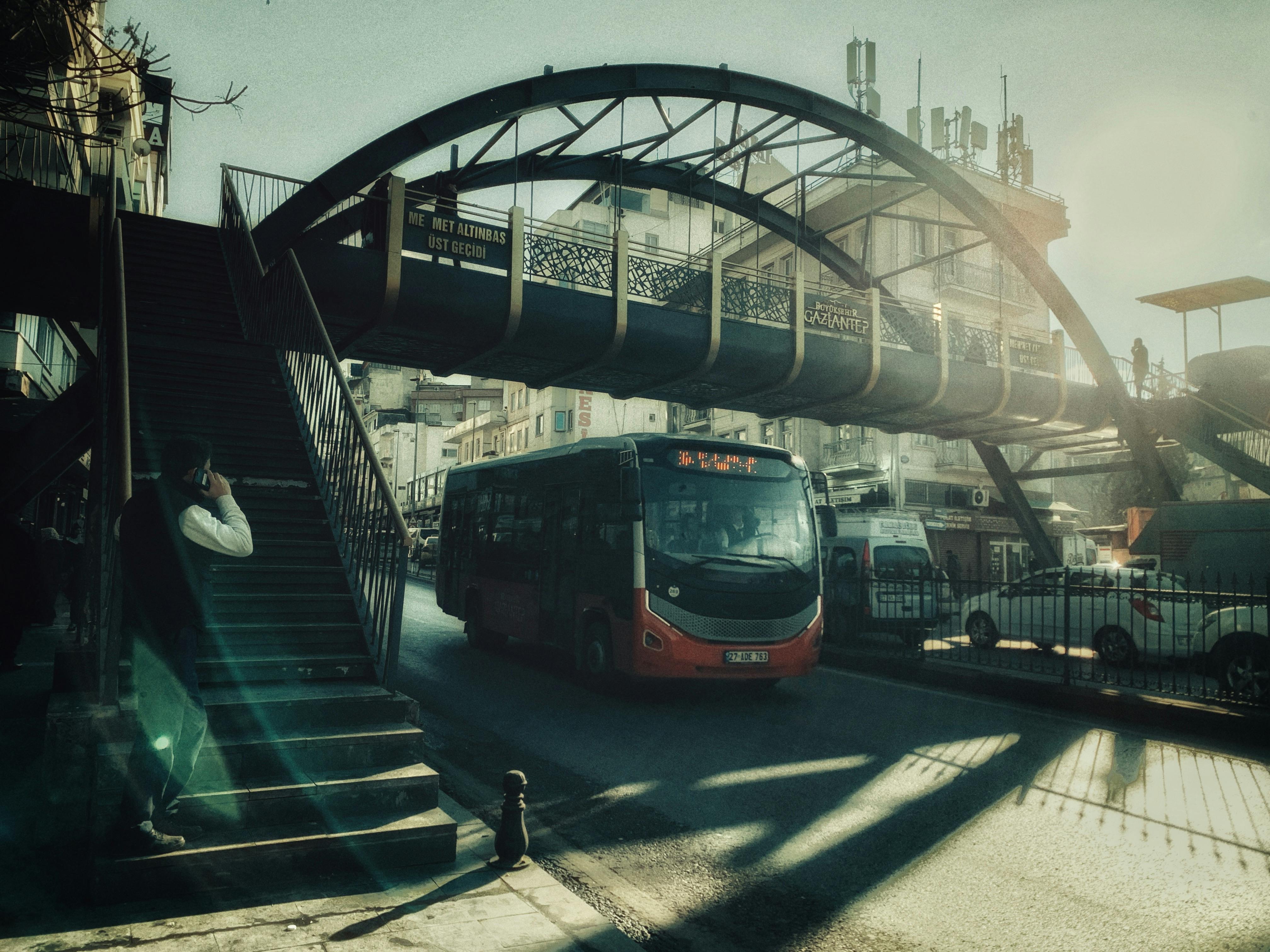 Cityscape with Bus and Pedestrian Overpass · Free Stock Photo