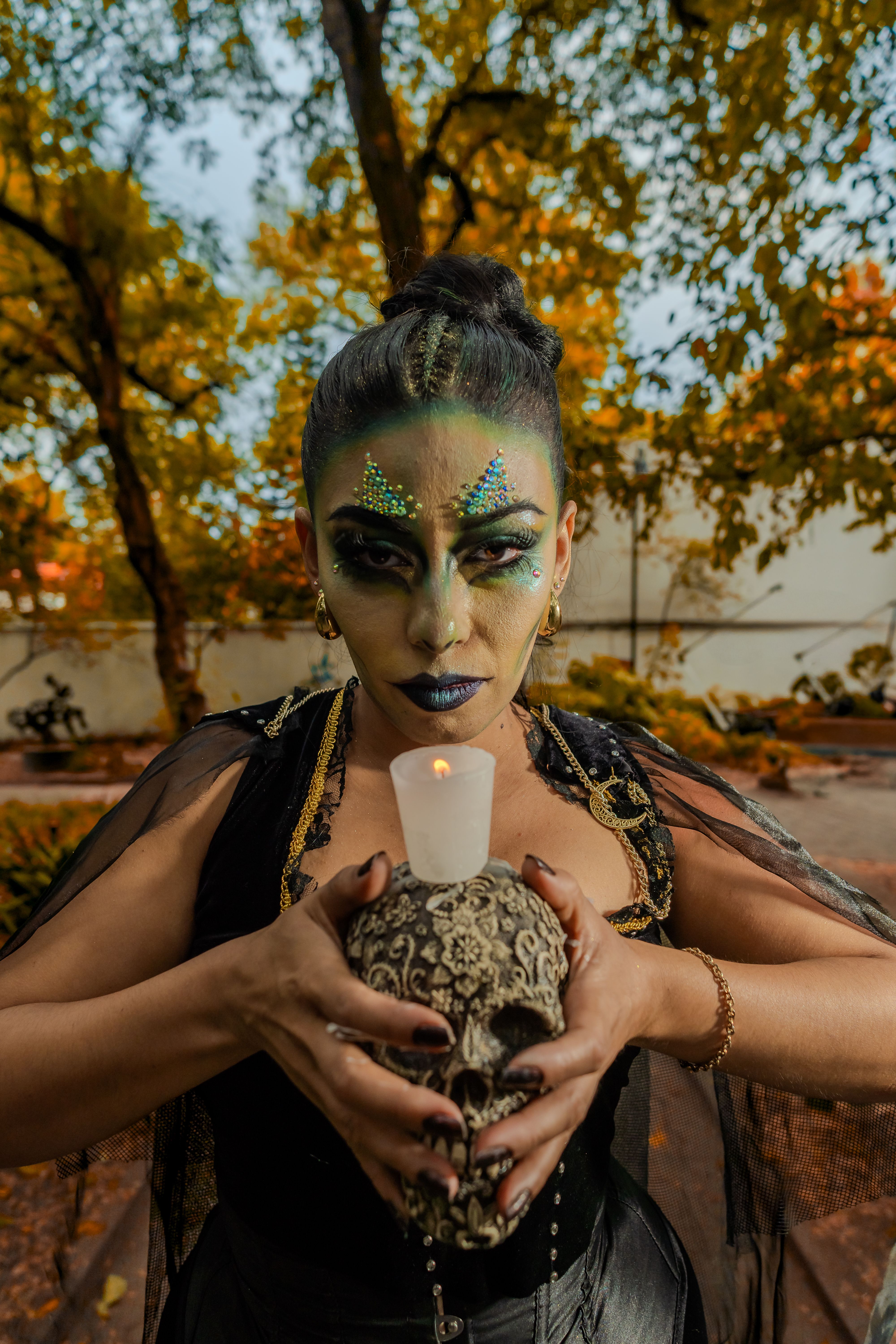 Surreal Portrait with Skull and Candle in Autumn Setting · Free Stock Photo