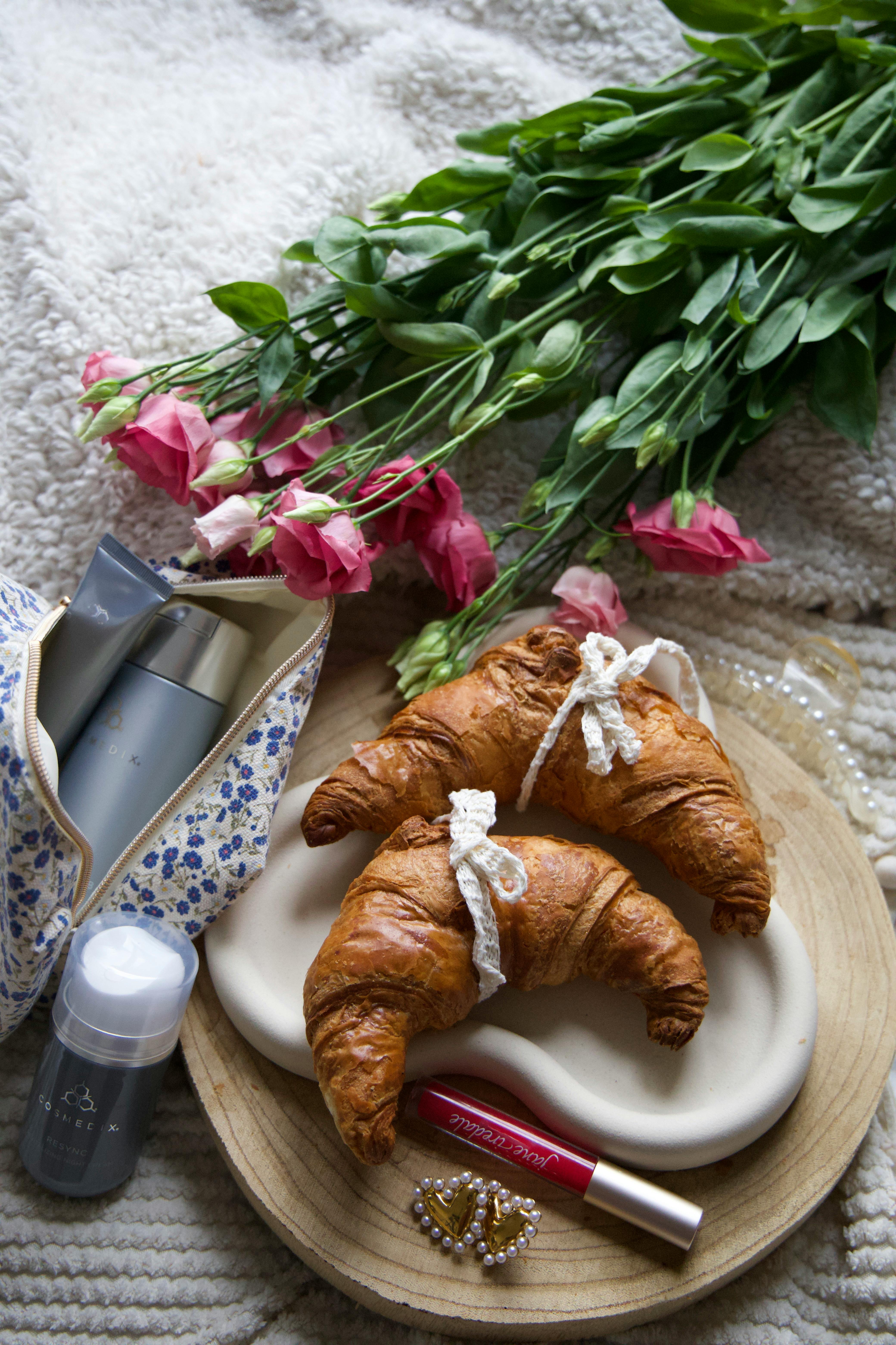 Elegant Breakfast Setting with Croissants and Roses · Free Stock Photo