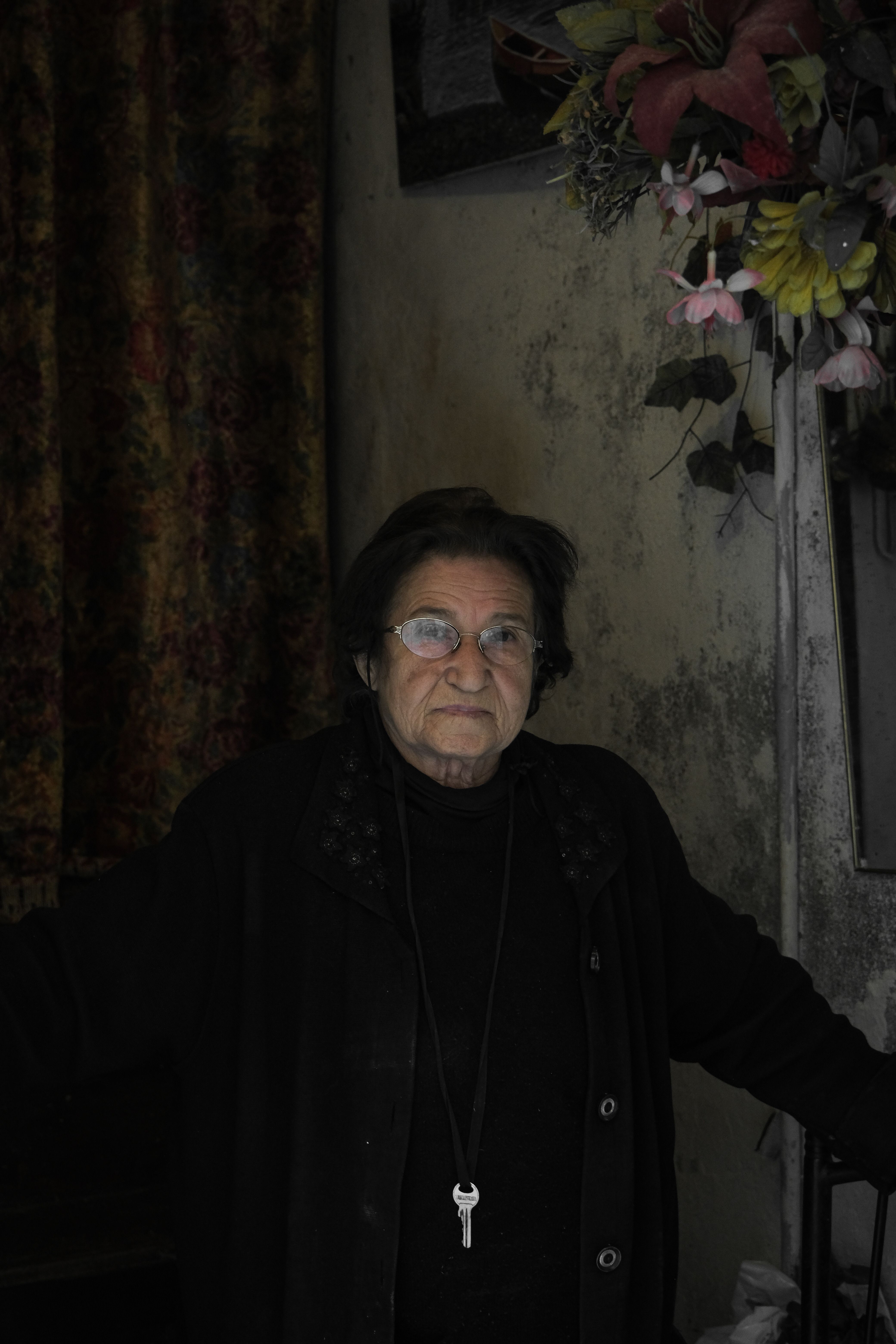 Portrait of Senior Woman in Dimly Lit Room · Free Stock Photo