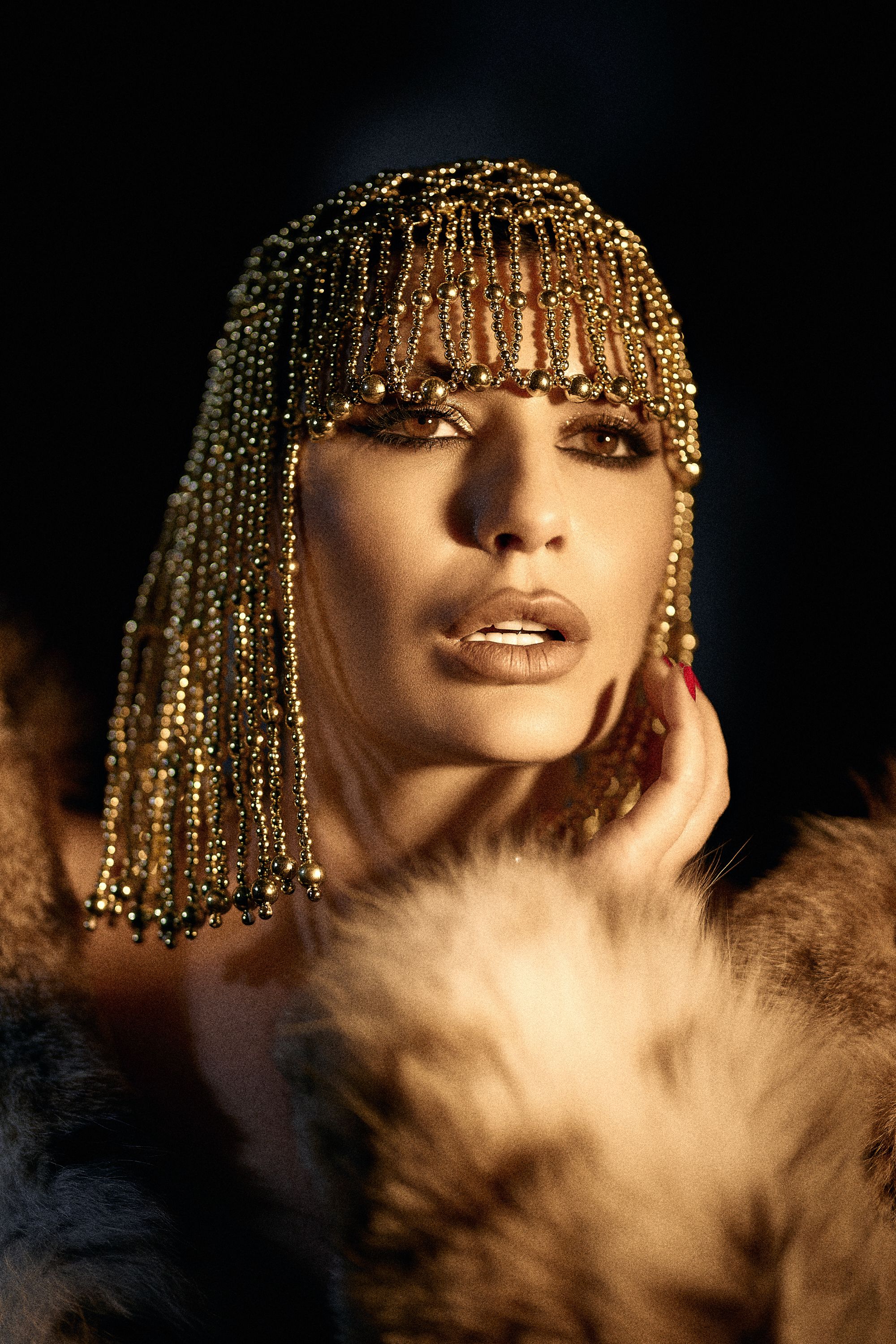Glamorous Woman in Beaded Headdress Portrait · Free Stock Photo