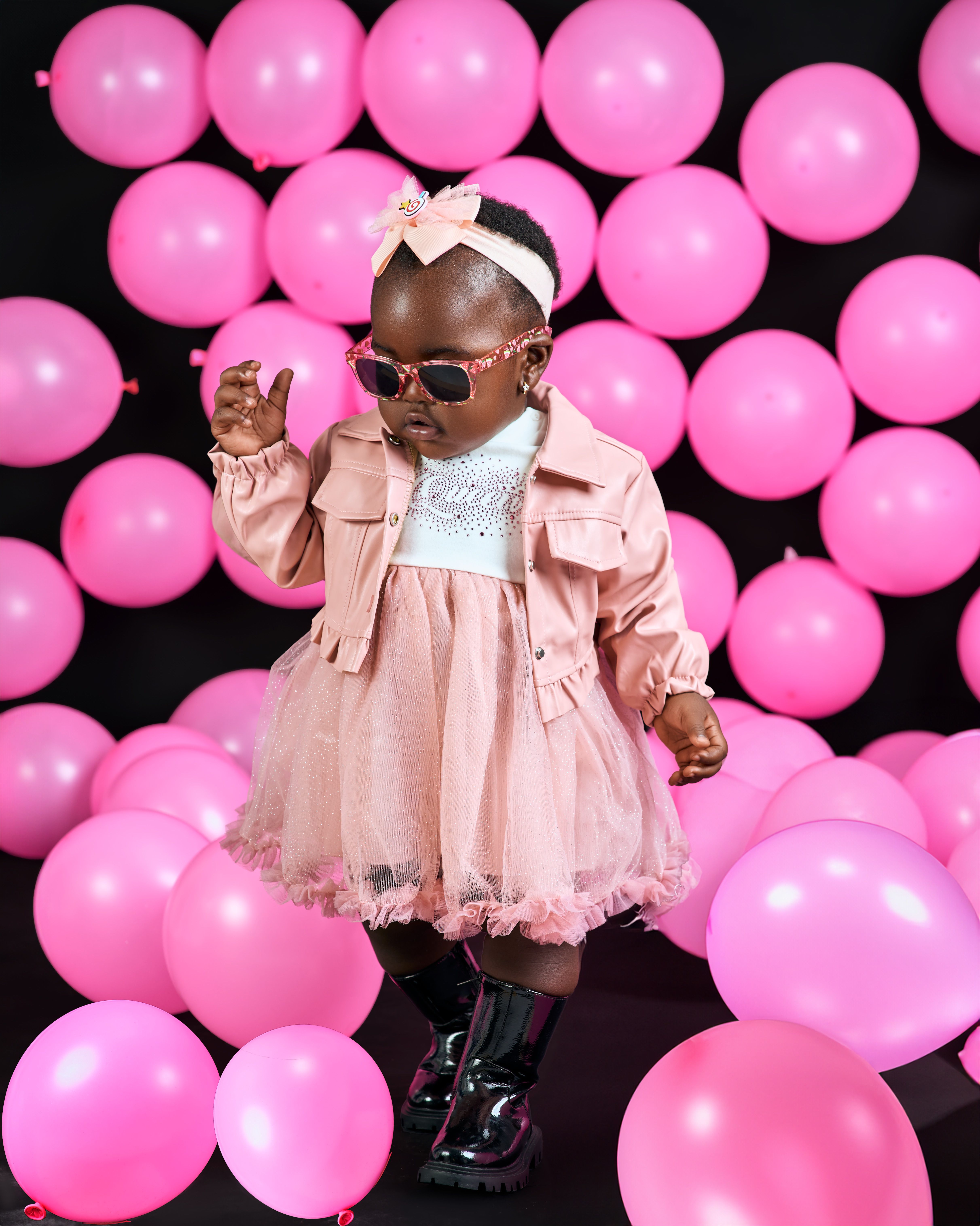 Adorable Baby in Pink Surrounded by Balloons · Free Stock Photo