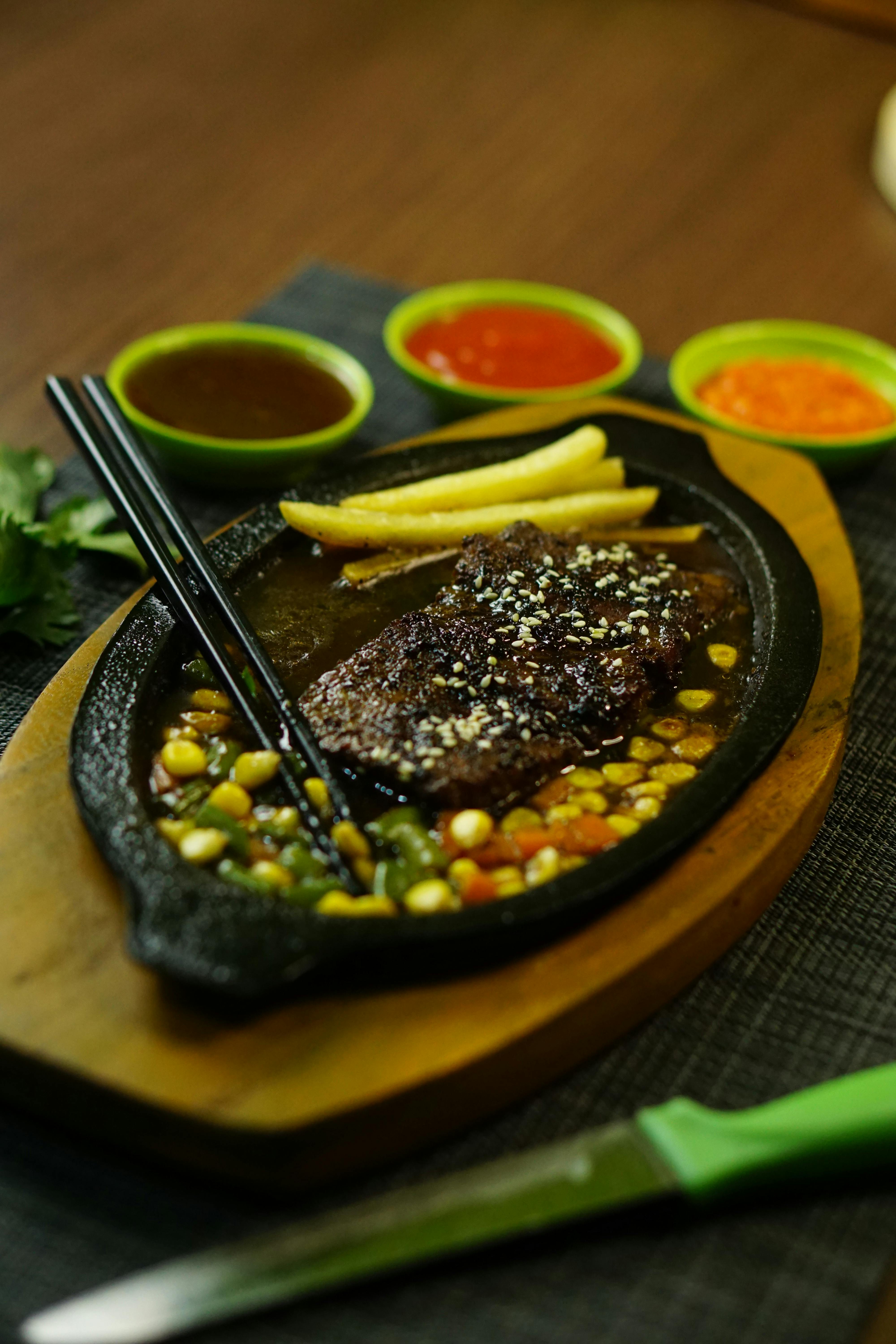 Sizzling Indonesian Steak with Dipping Sauces · Free Stock Photo