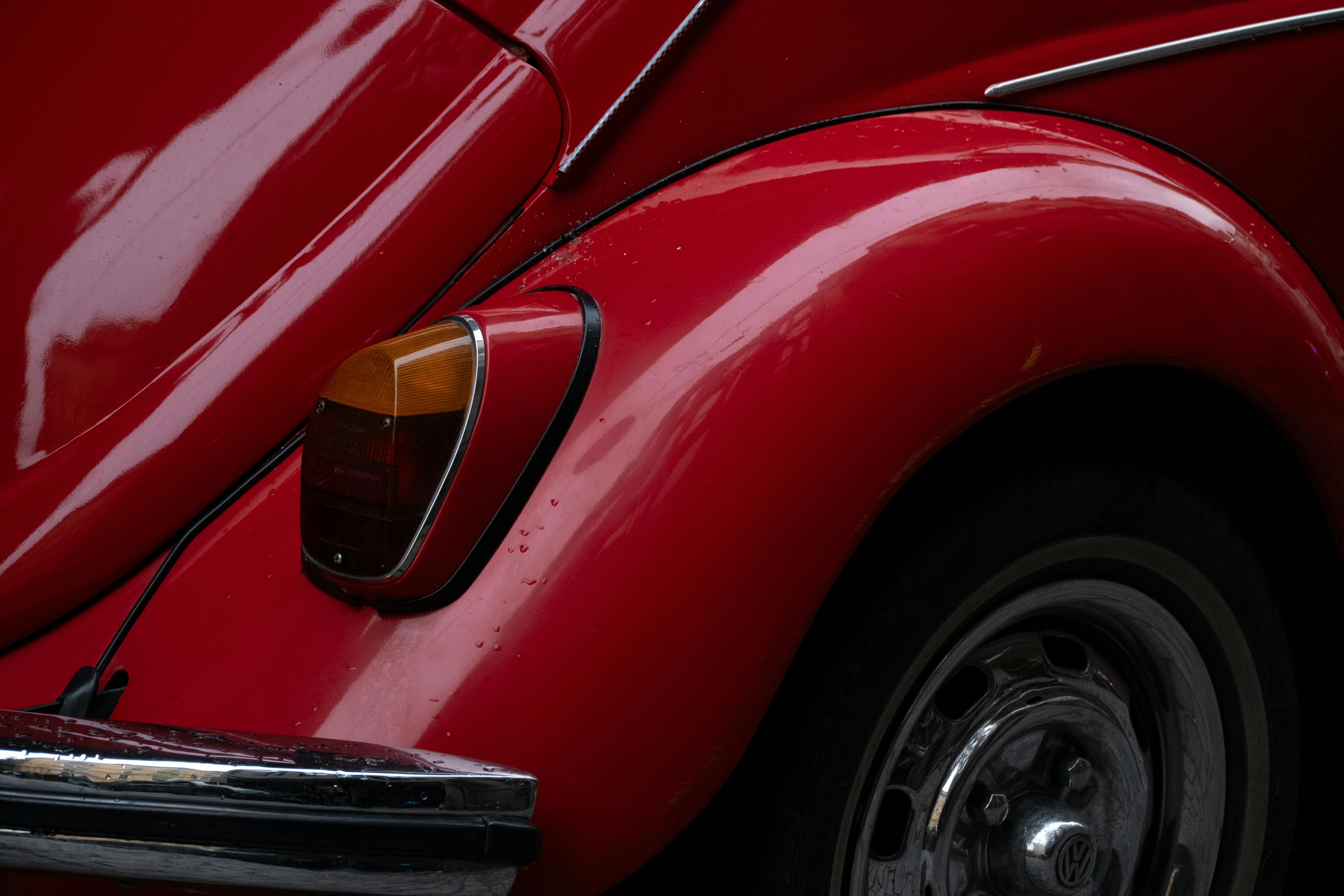 Close-Up of Classic Red Volkswagen Beetle Tail Light · Free Stock Photo