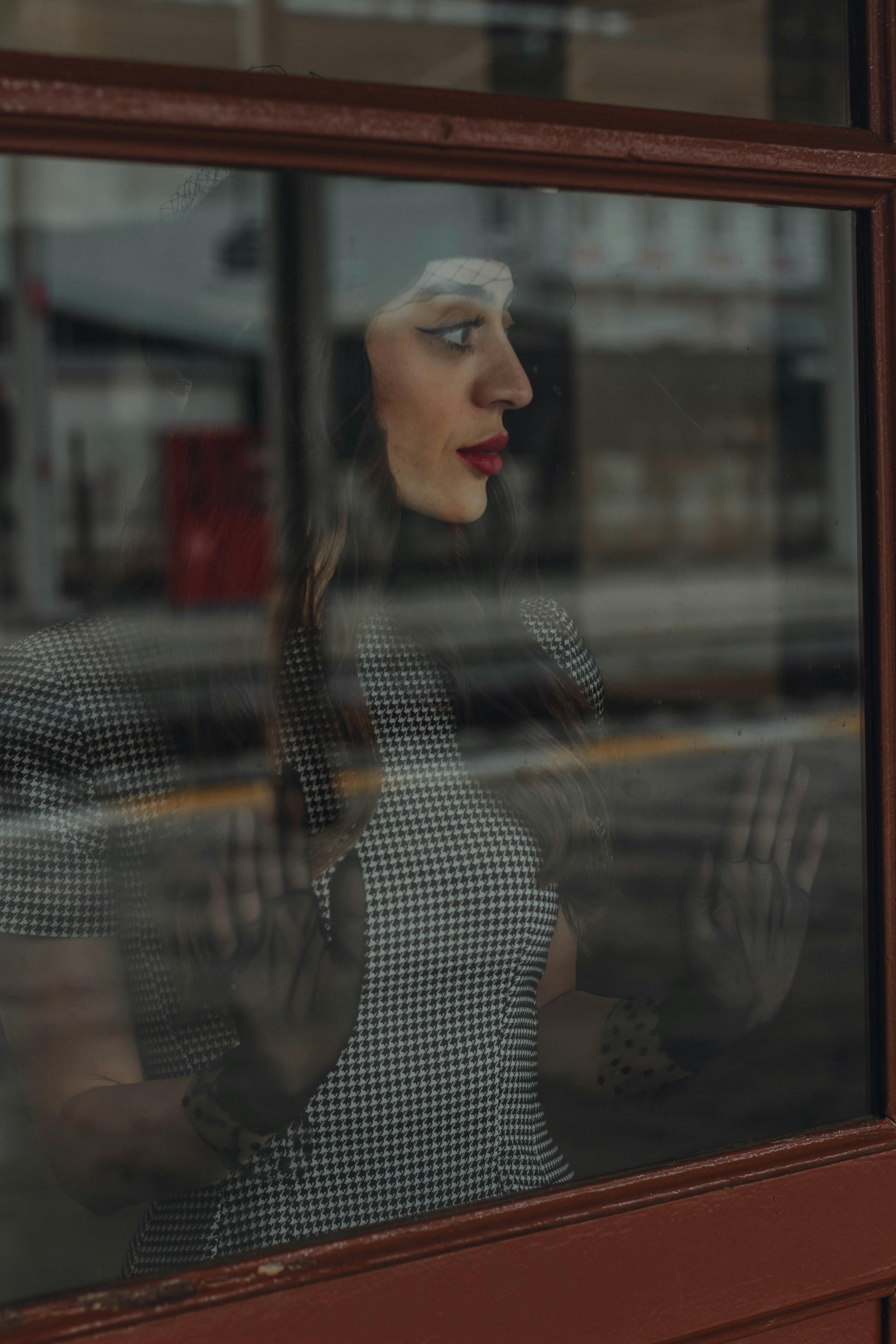 Reflective Portrait of Woman at Window in Istanbul · Free Stock Photo