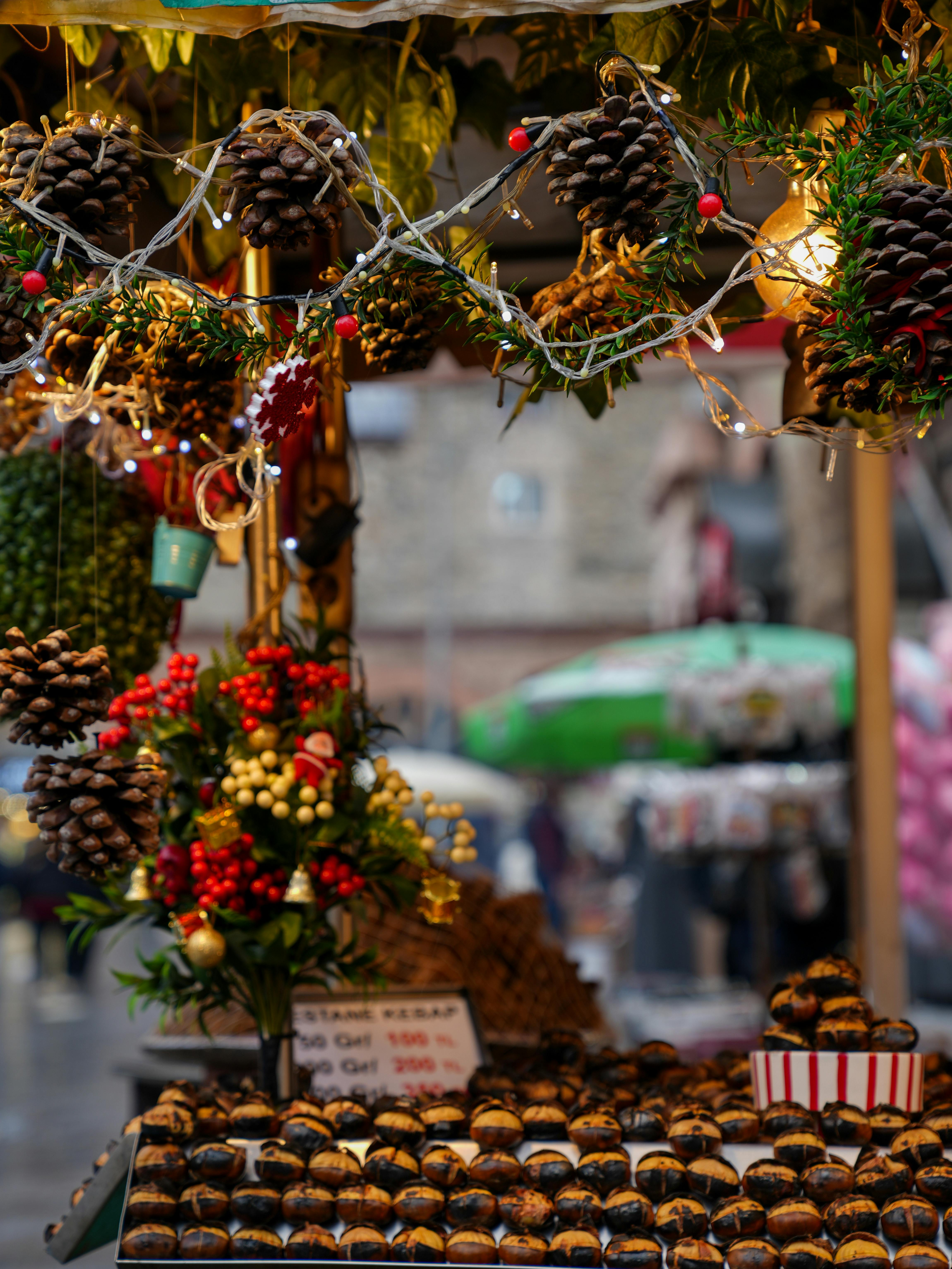 Festive Market Stall with Pinecone Decor · Free Stock Photo