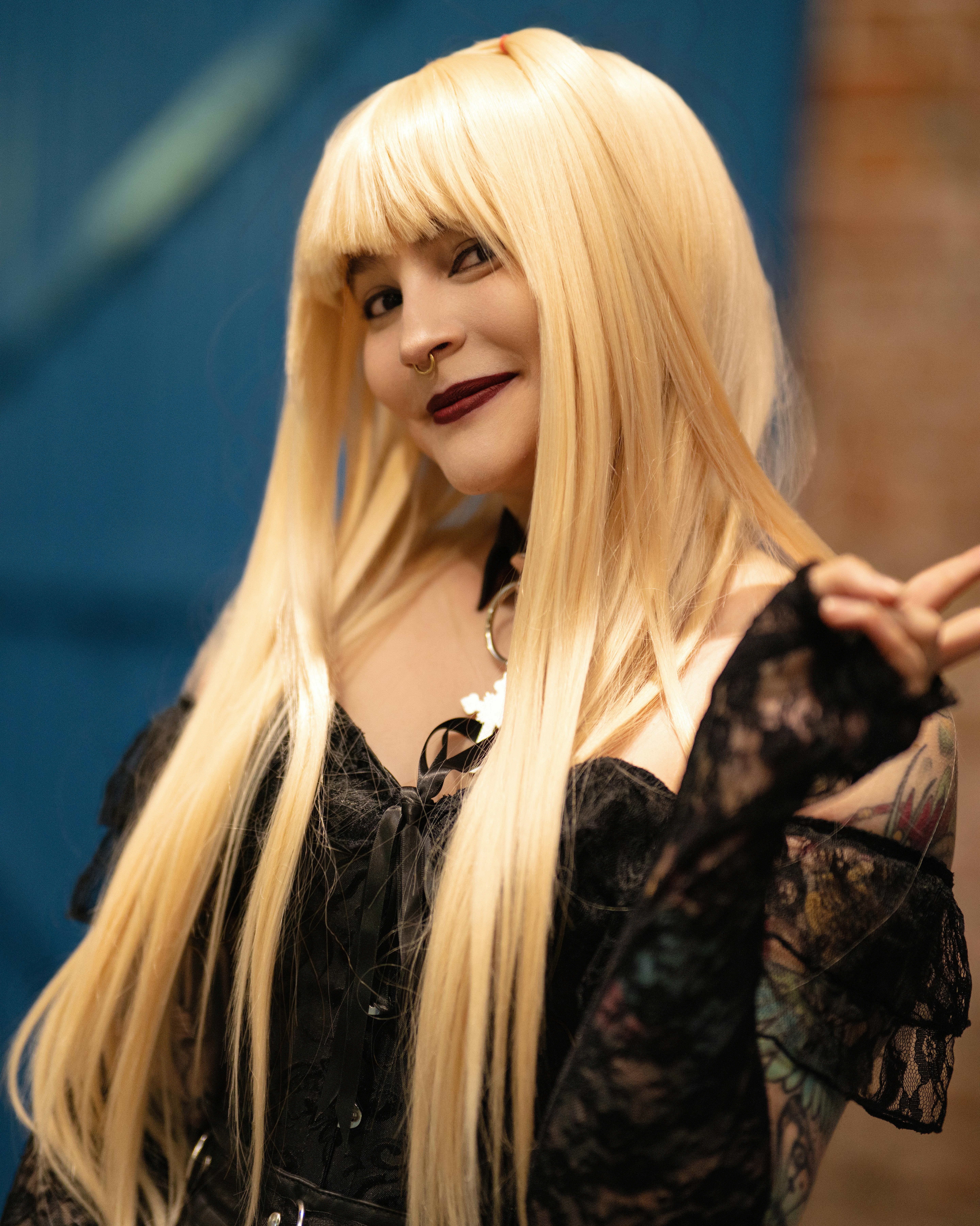 Blonde Cosplayer in Black Gothic Outfit Smiling · Free Stock Photo