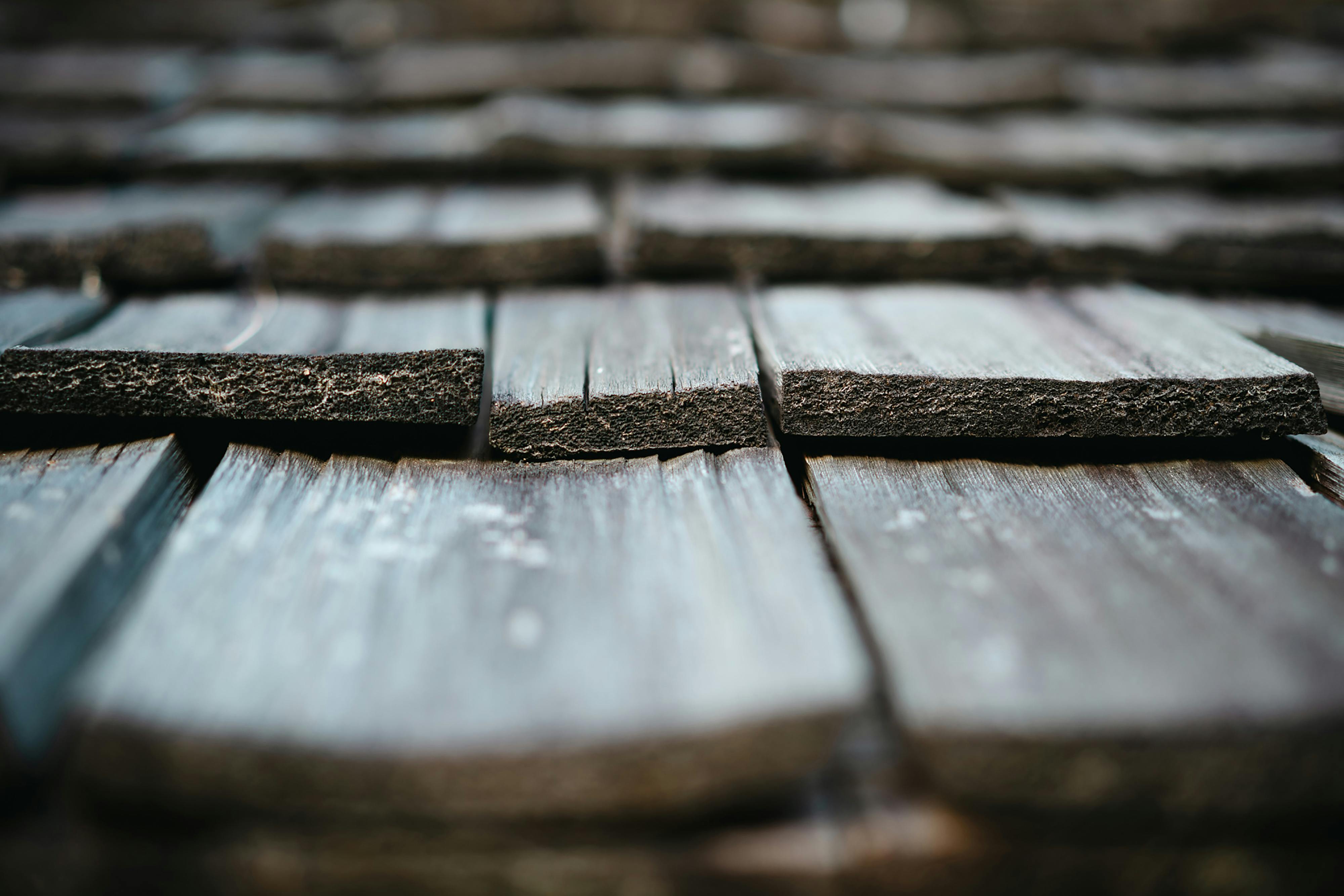 Close-Up of Rustic Weathered Wooden Shingles · Free Stock Photo