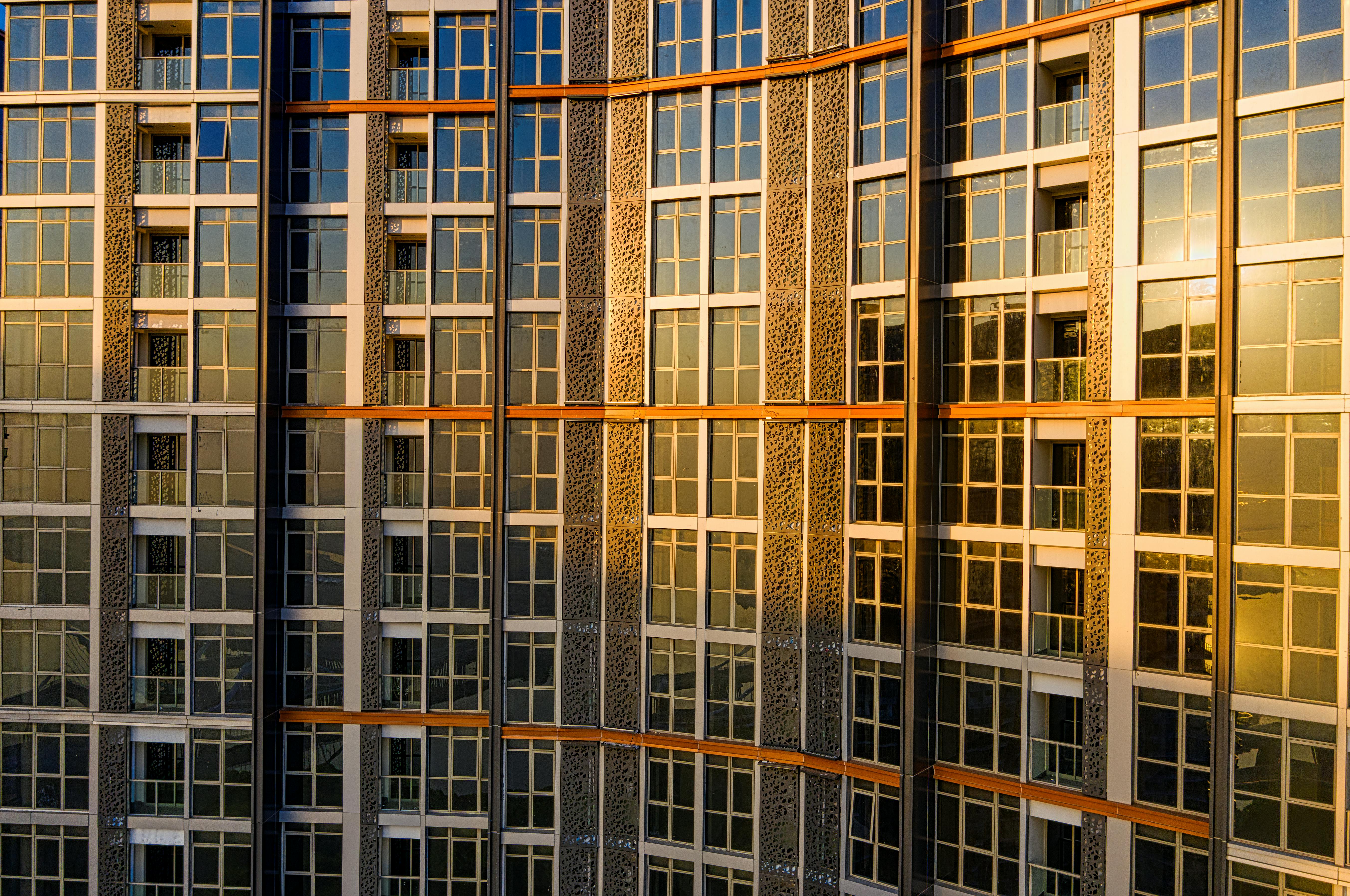 Glass Windows of A High-rise Building · Free Stock Photo