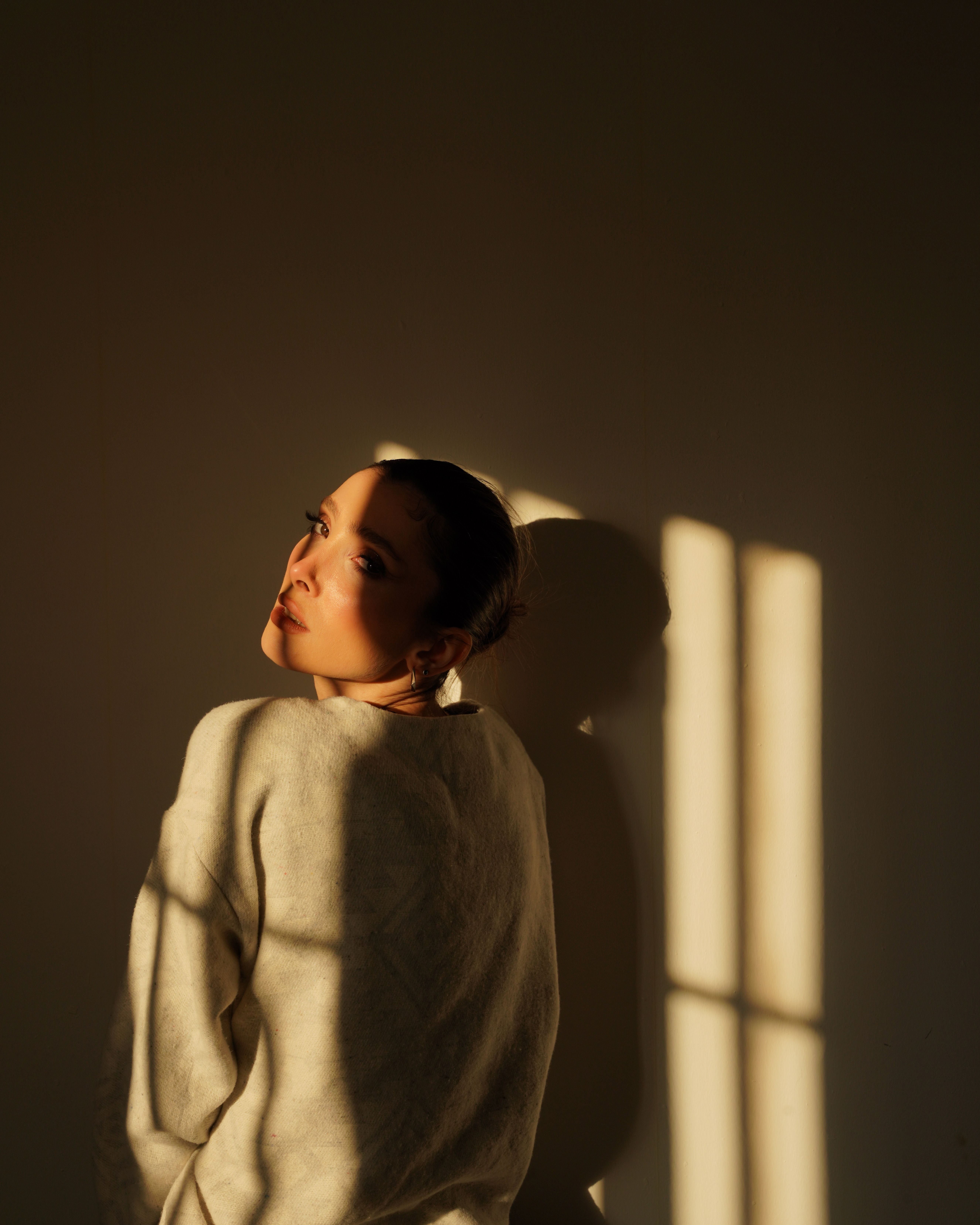 Moody Indoor Portrait with Dramatic Shadows · Free Stock Photo