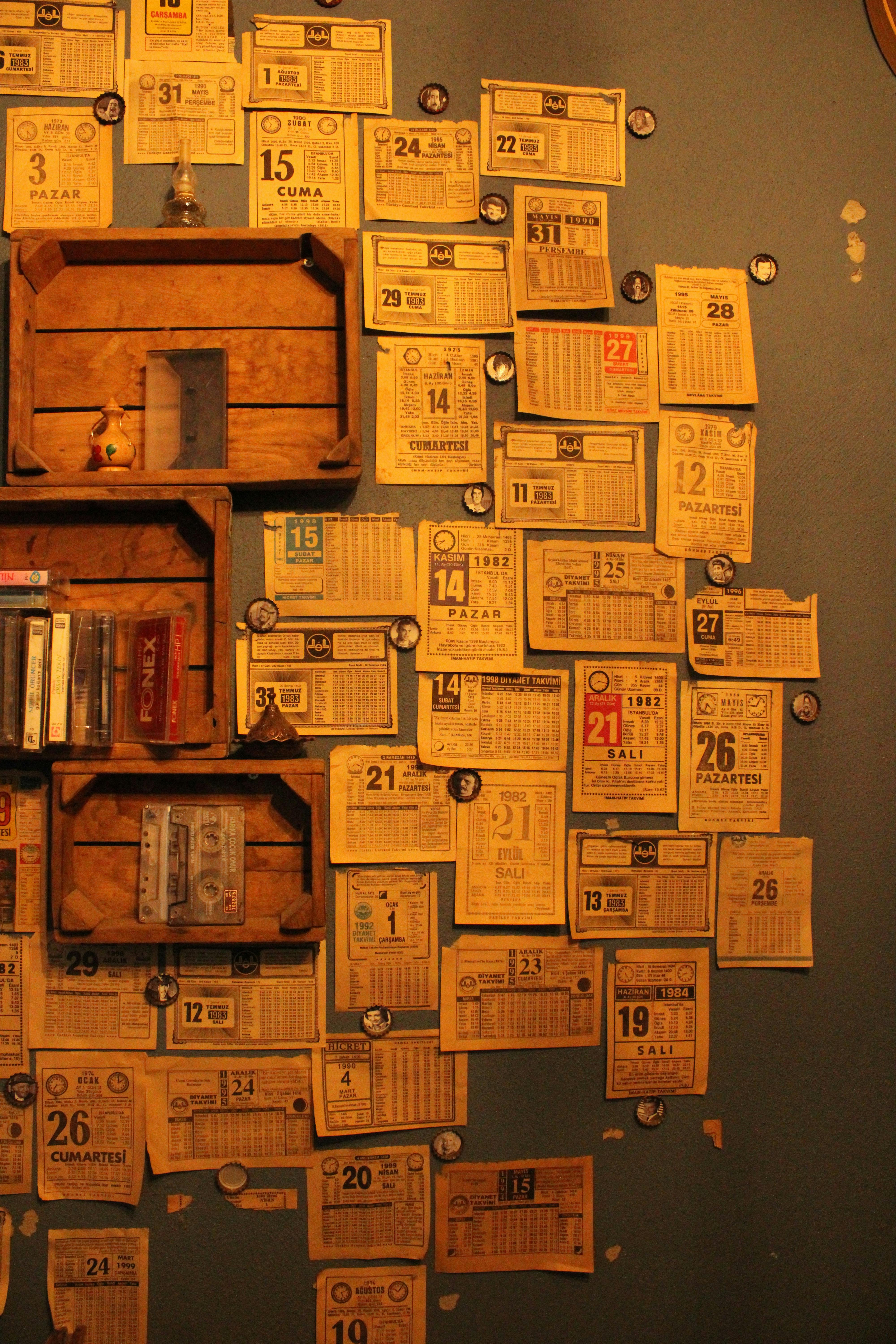 Vintage Wall with Retro Calendars and Cassettes · Free Stock Photo