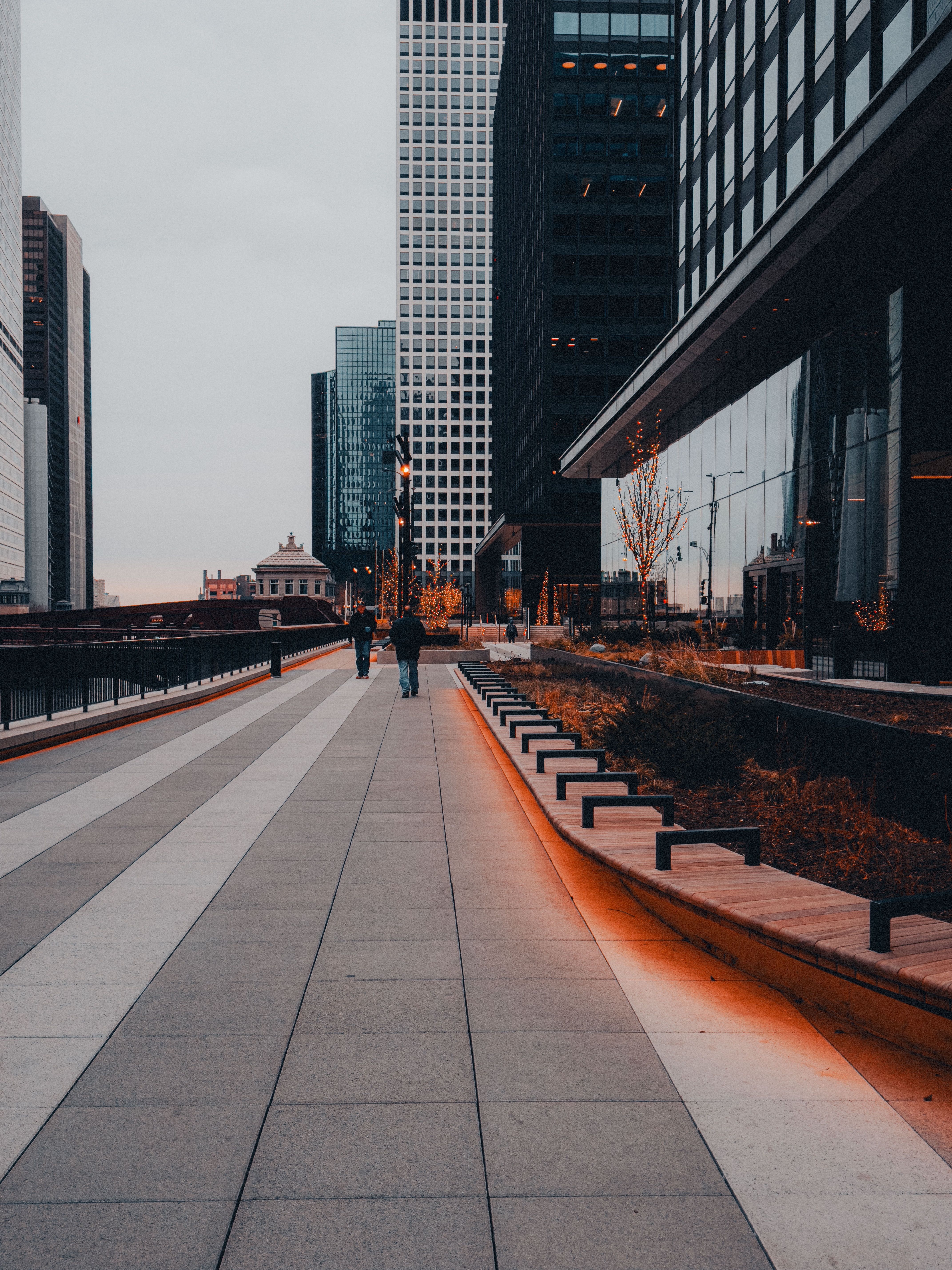 Modern Urban Street with Skyscrapers at Dusk · Free Stock Photo