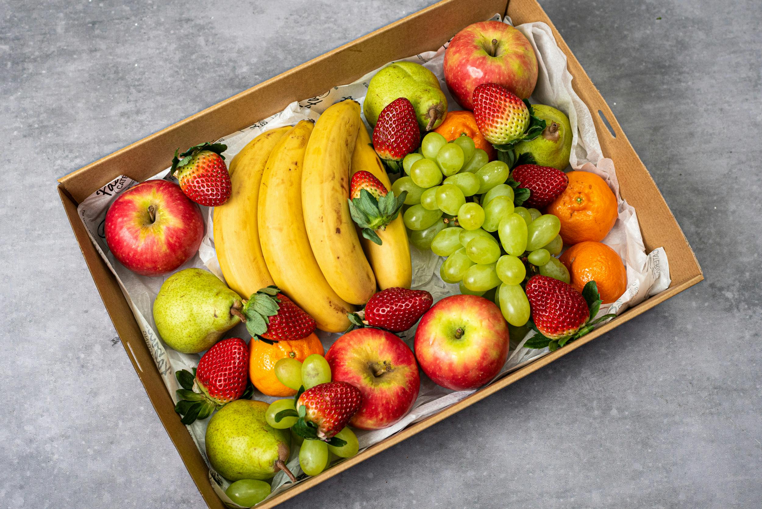 Vibrant Fresh Fruit Box for Healthy Eating · Free Stock Photo
