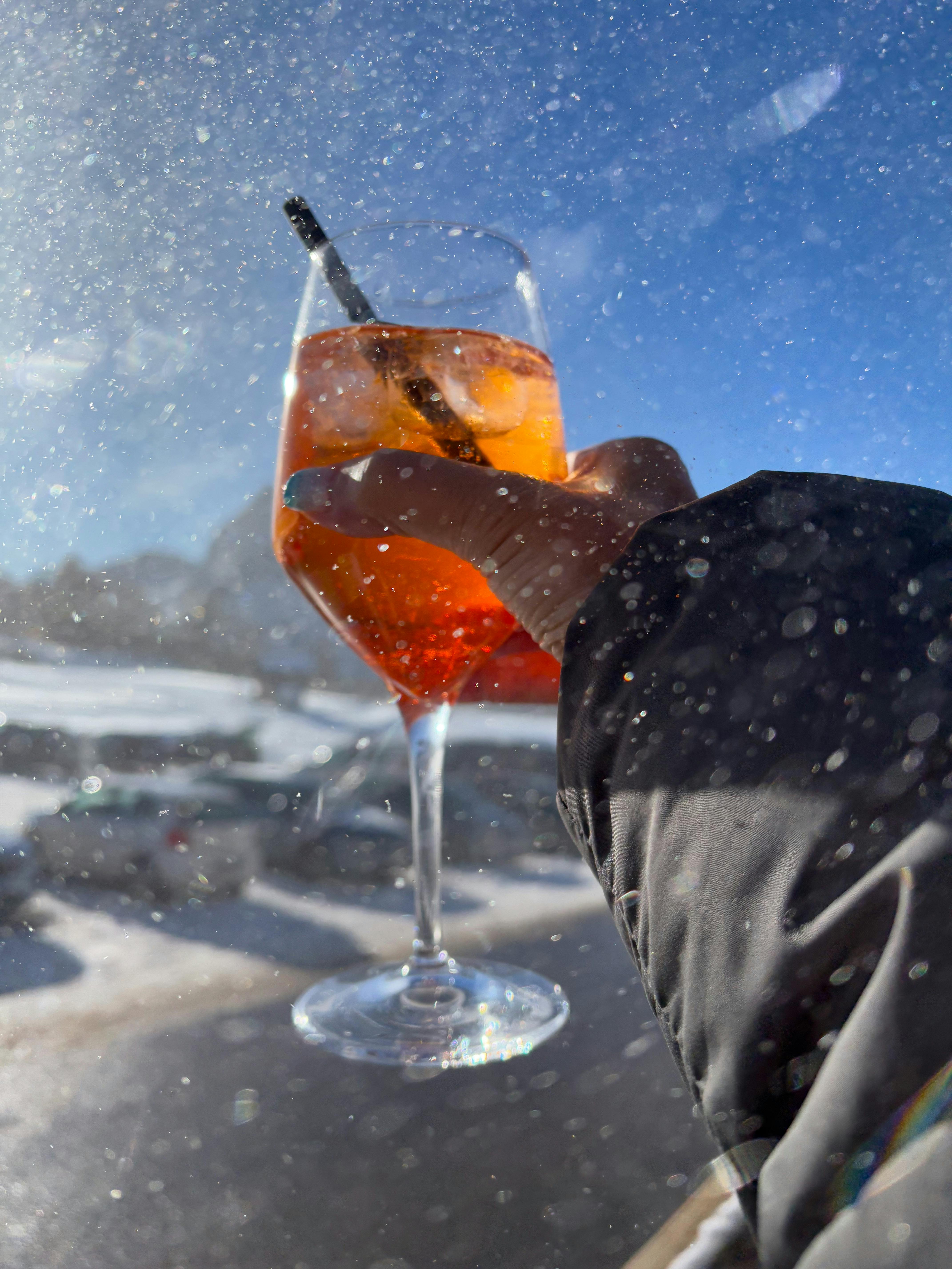 Aperol Spritz in a Winter Ski Resort Setting · Free Stock Photo