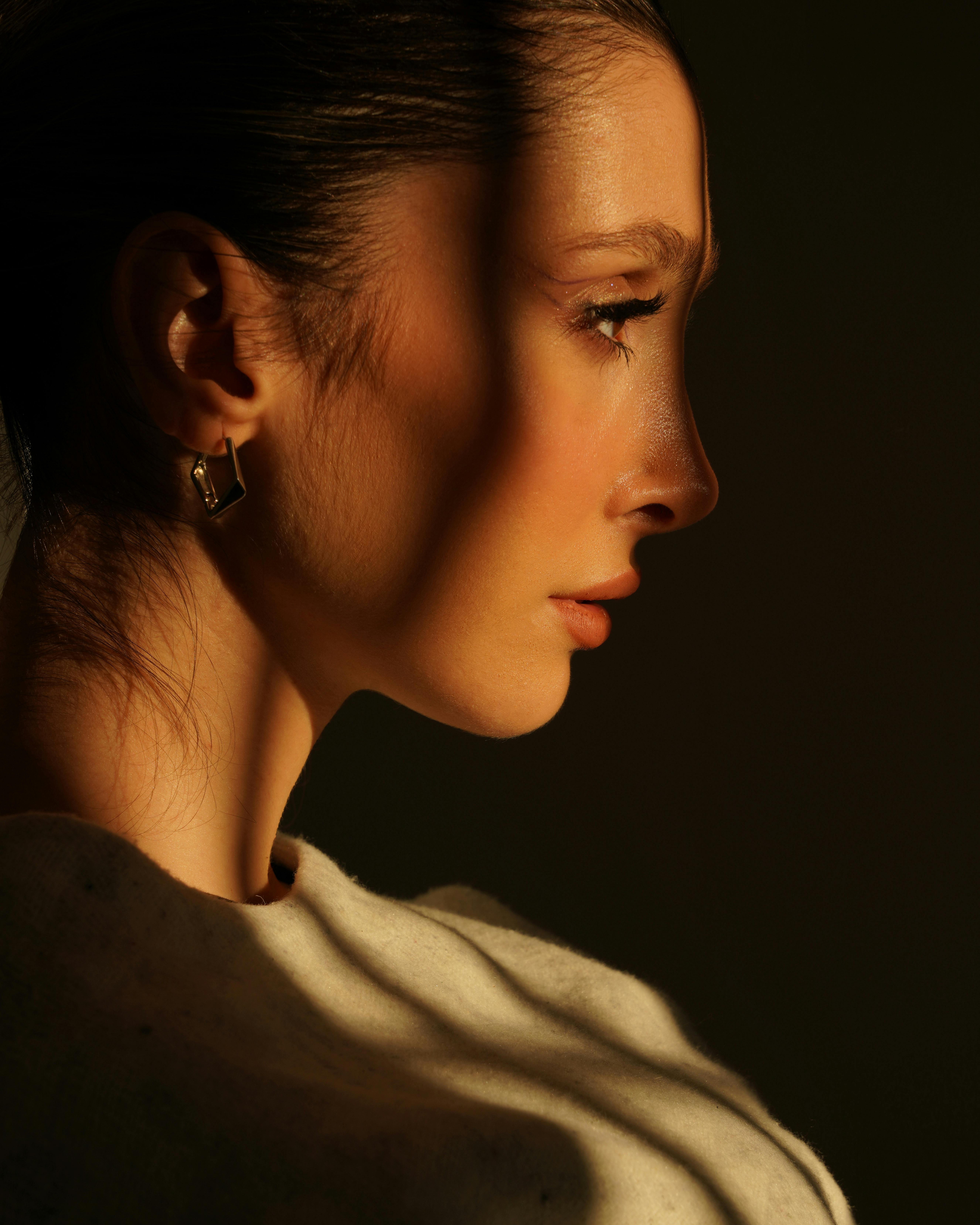 Dramatic Profile Portrait in Warm Lighting · Free Stock Photo