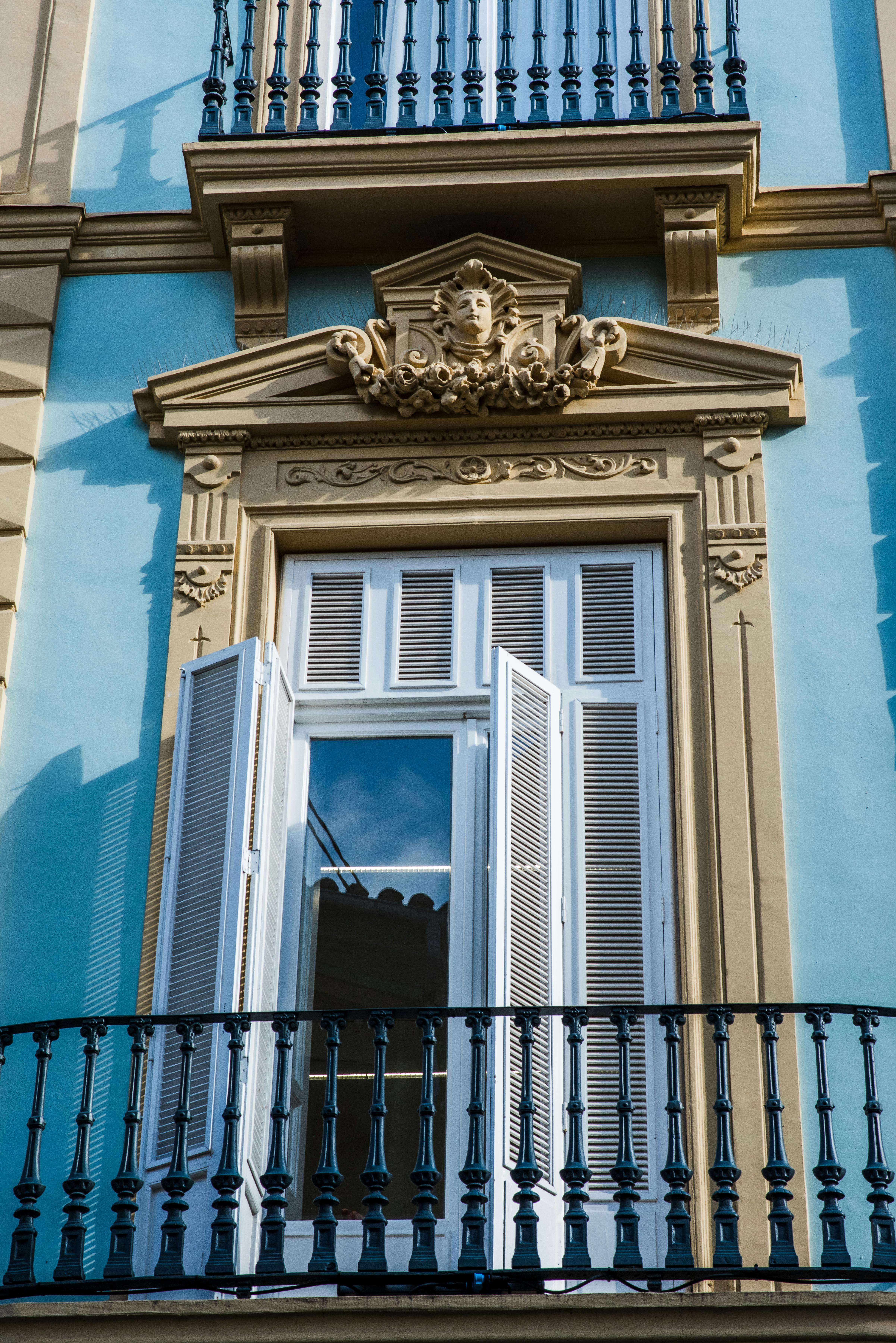 Elegant European Balcony with Classical Architecture · Free Stock Photo