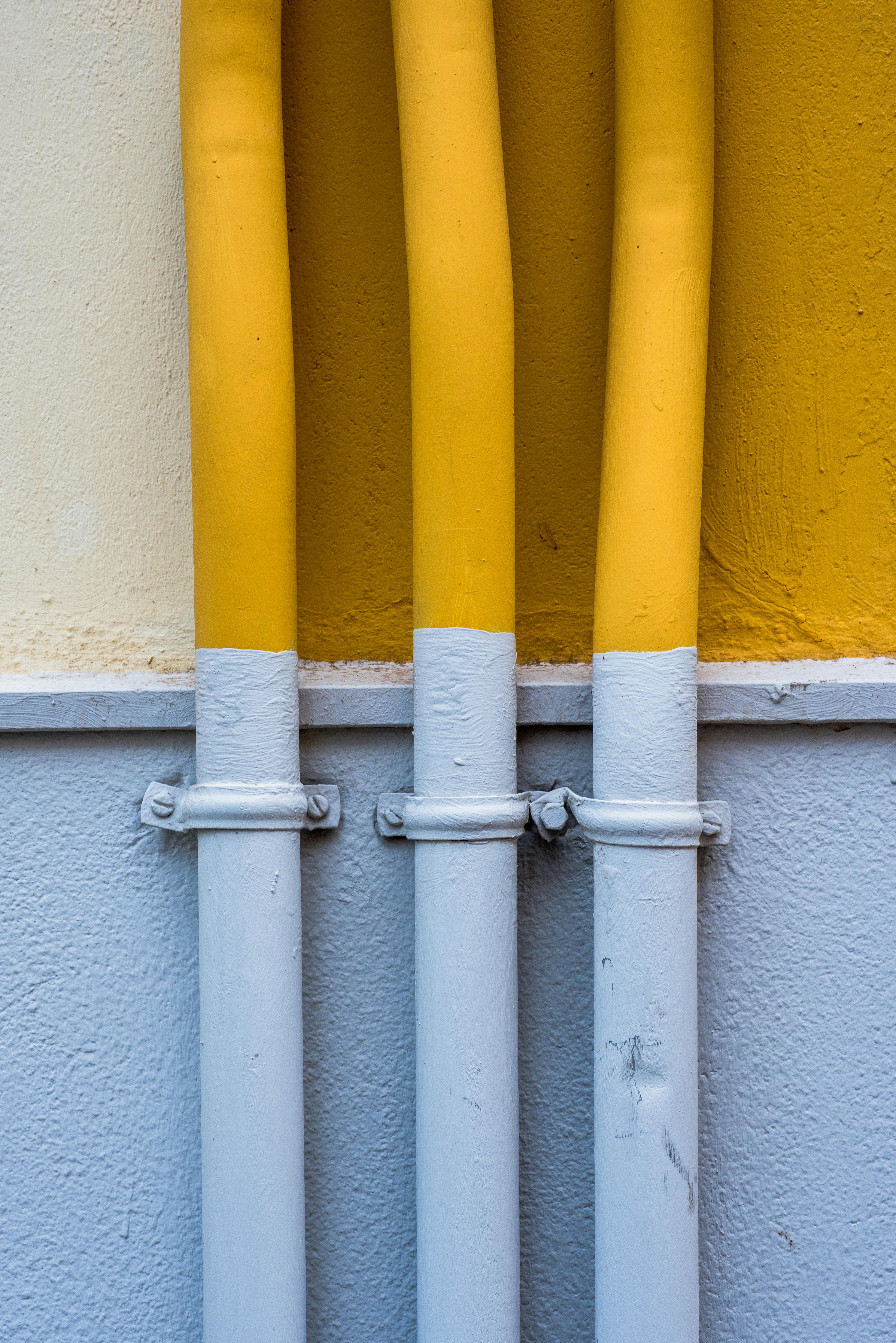Colorful Contrasting Industrial Pipes on Wall · Free Stock Photo