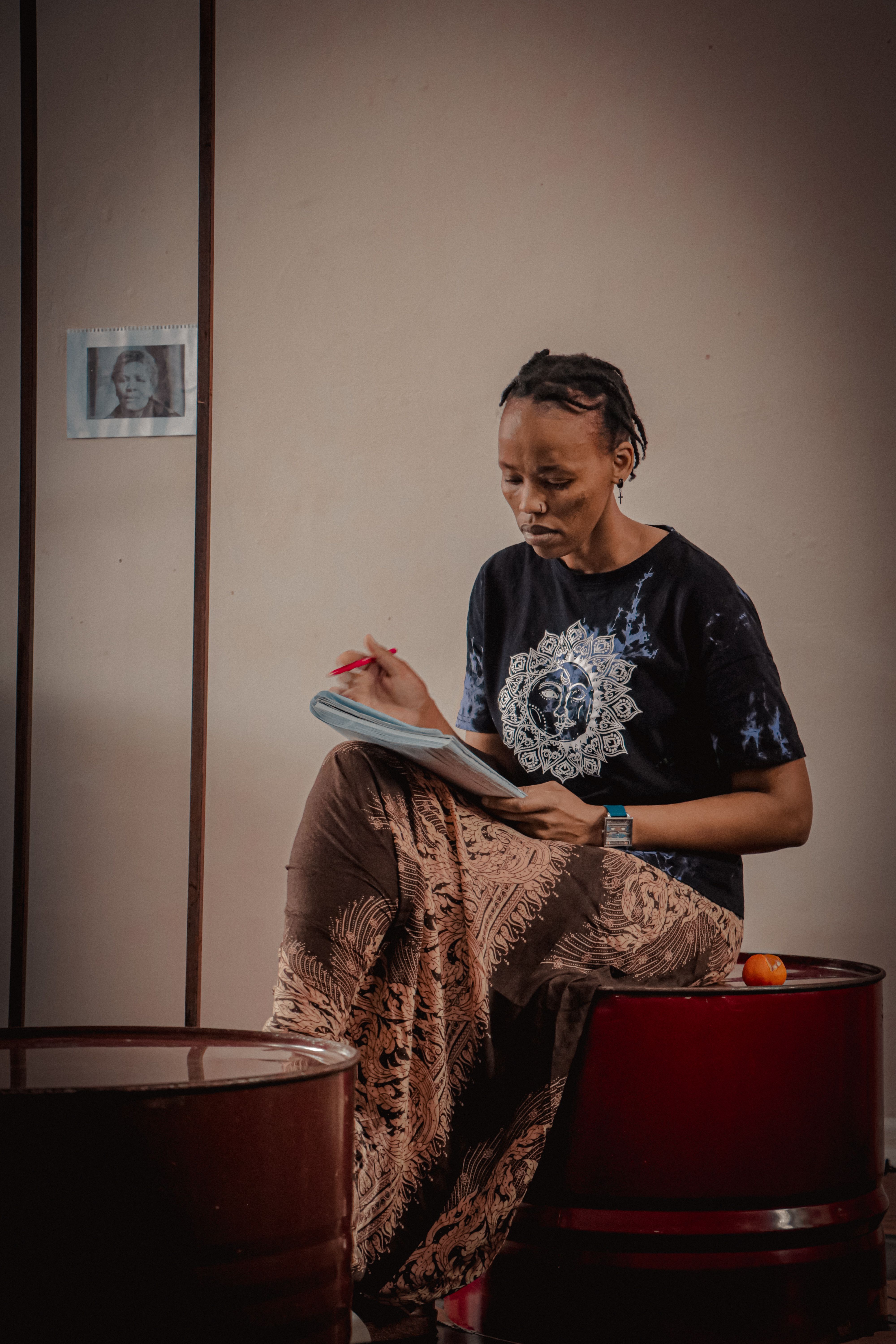 Woman Writing in Notebook Indoors in Cape Town · Free Stock Photo