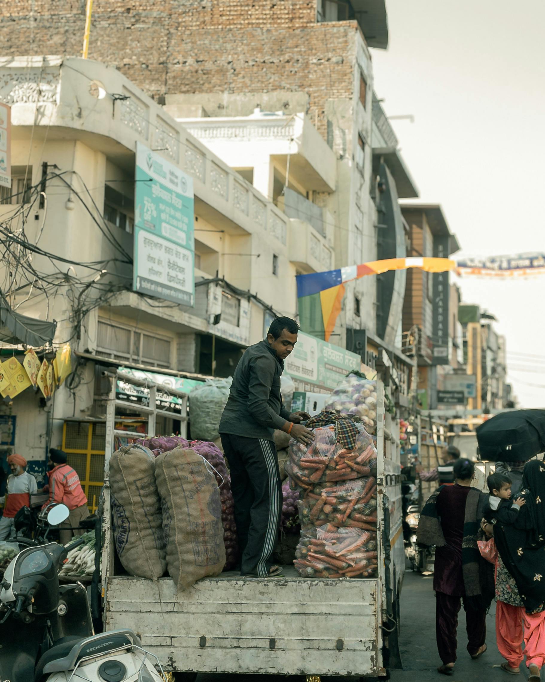 Street Market Scene with Vegetable Vendor in City · Free Stock Photo