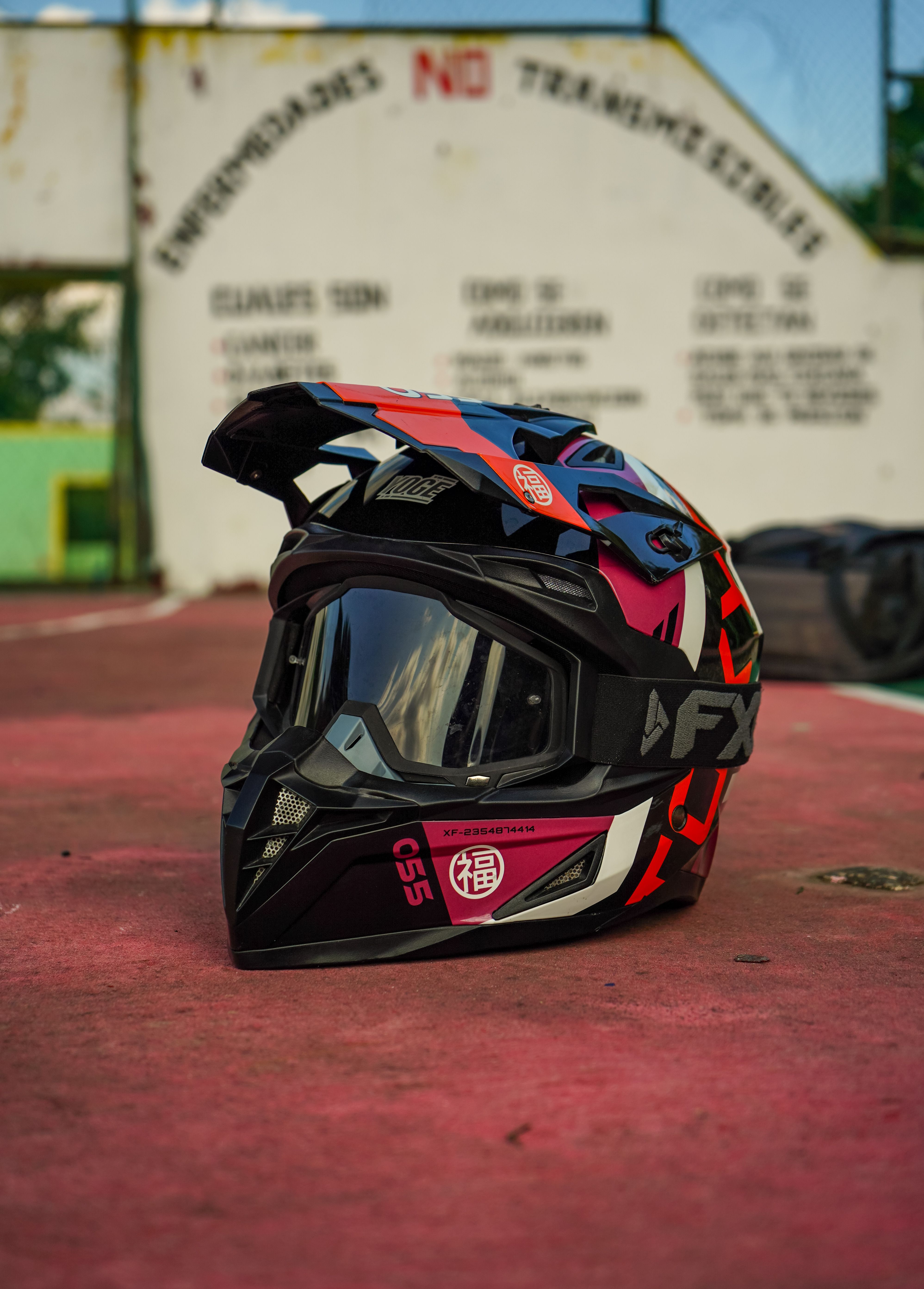 Colorful Motorcycle Helmet on Outdoor Court · Free Stock Photo