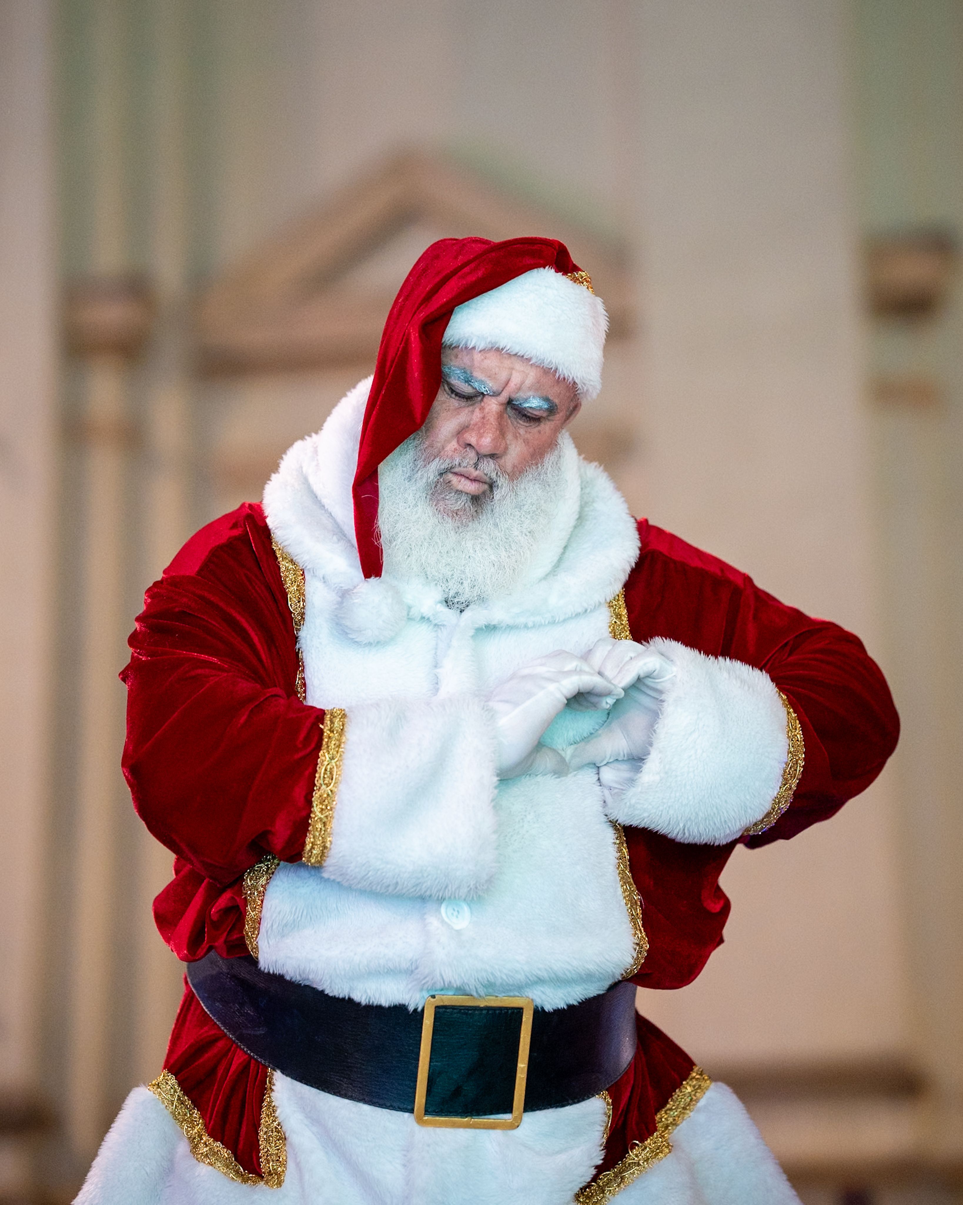 Santa Claus Posing Indoors with Heart Gesture · Free Stock Photo