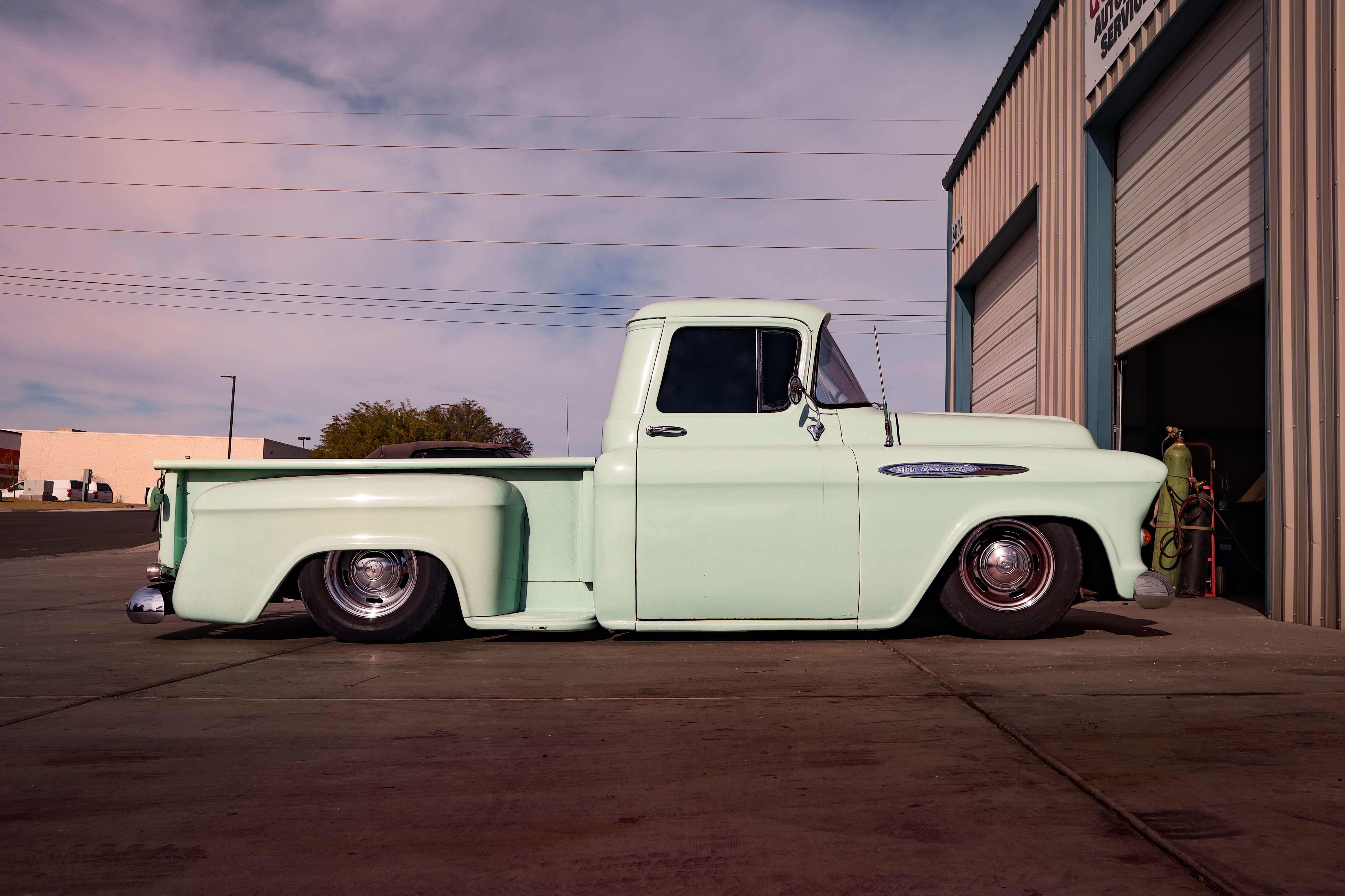 Vintage Mint Green Pickup Truck at Garage · Free Stock Photo