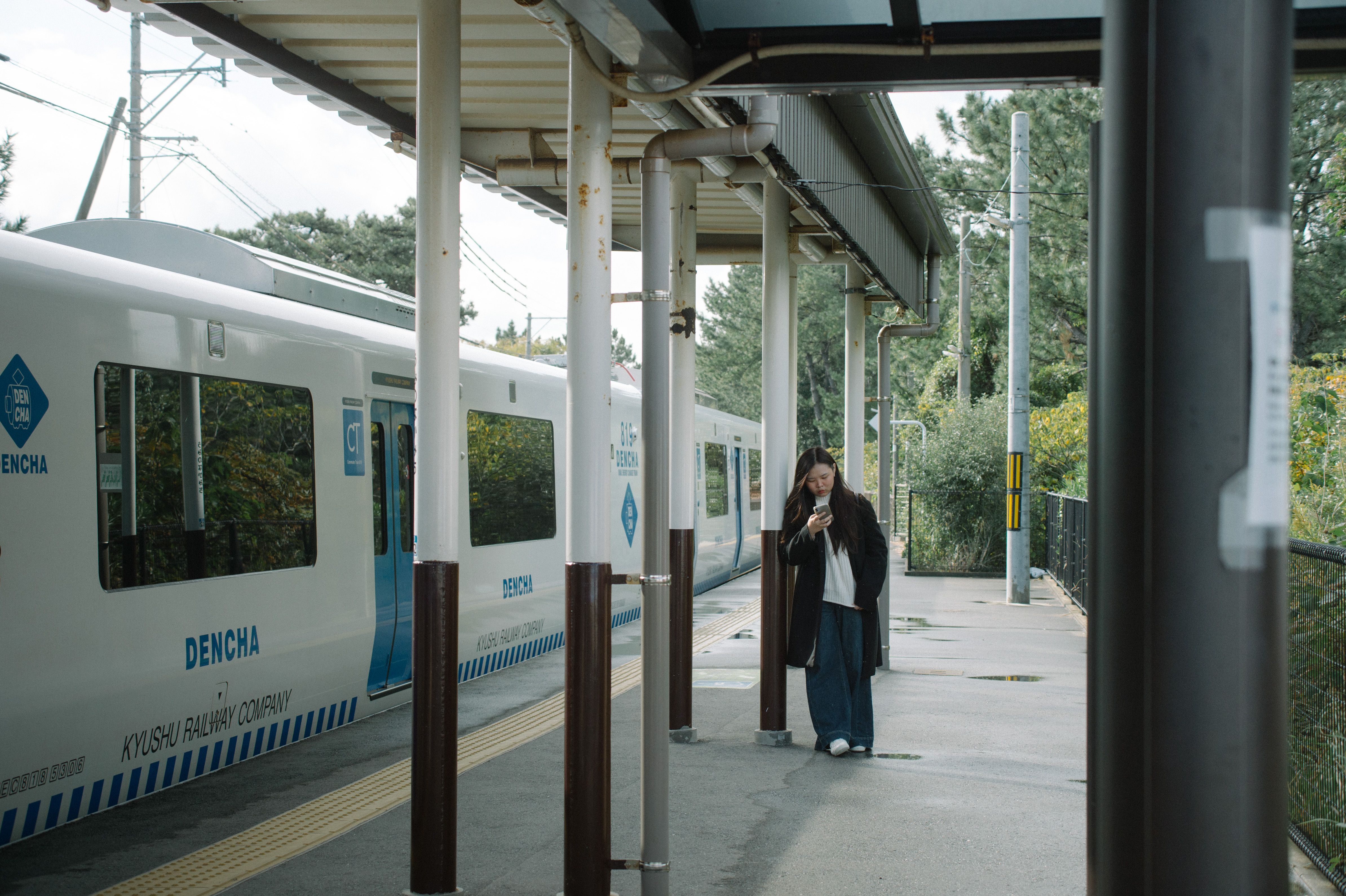 Woman Waiting at a Japanese Train Station · Free Stock Photo