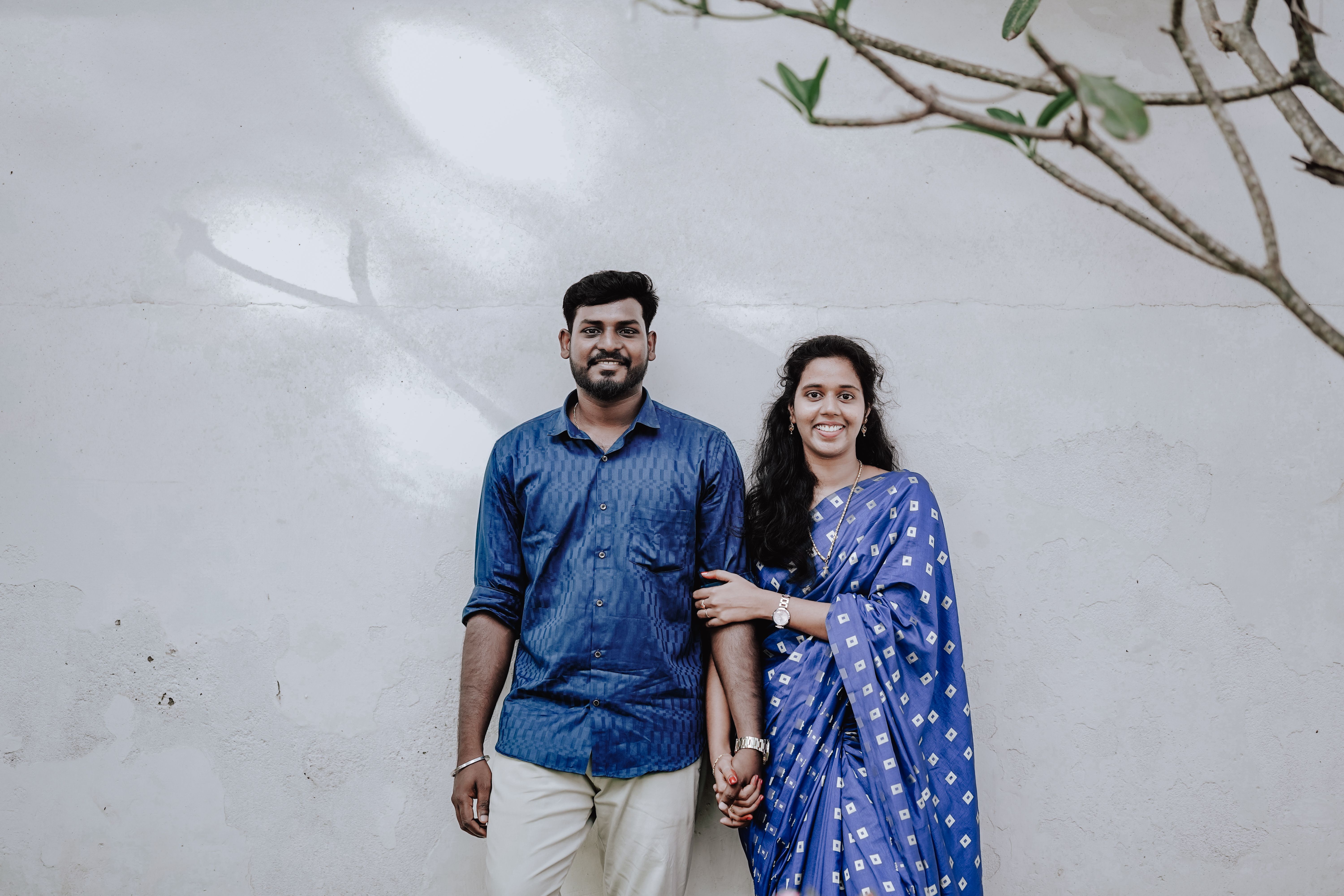 Happy couple in traditional Indian attire outdoors · Free Stock Photo