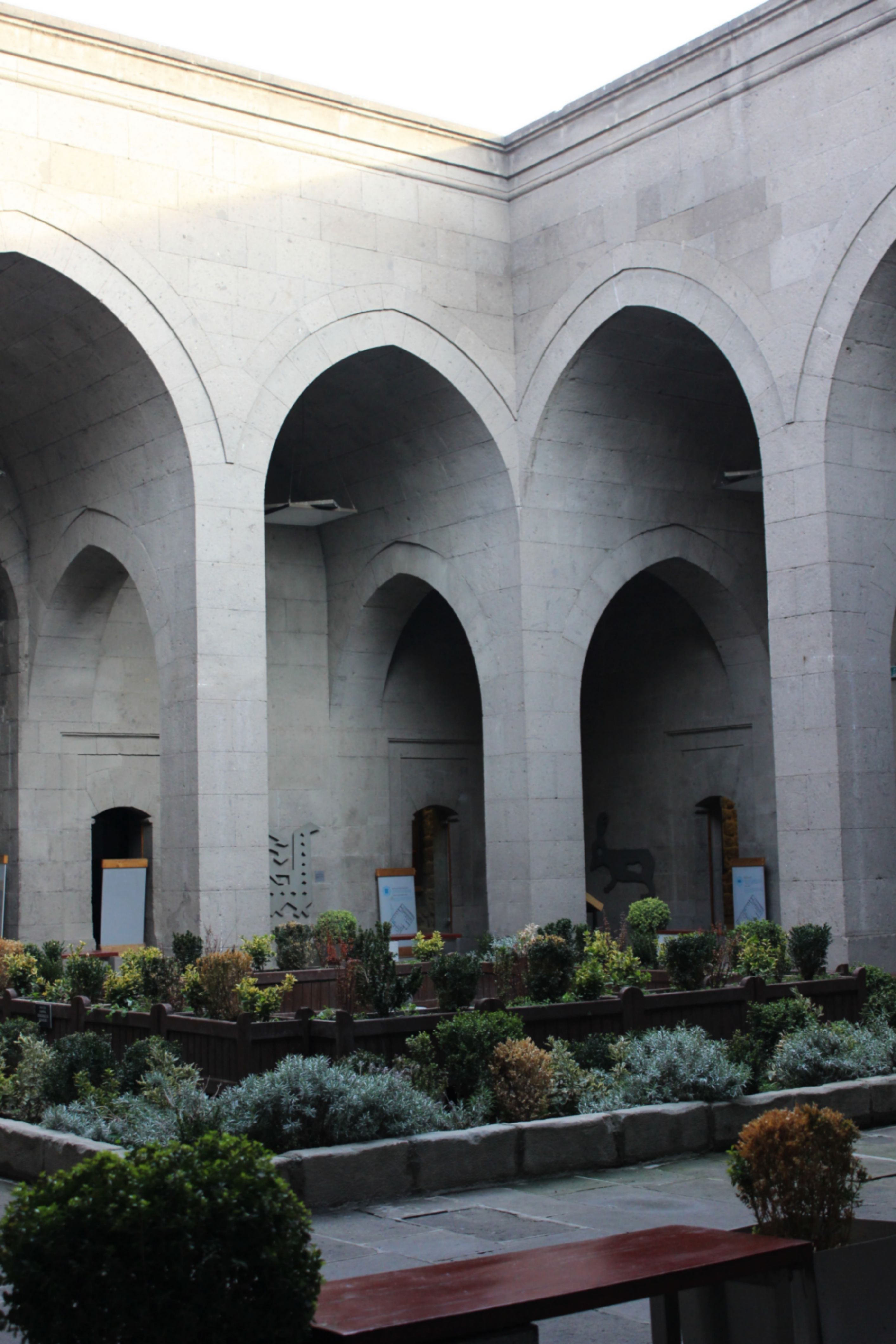 Historic Stone Courtyard with Arched Architecture · Free Stock Photo