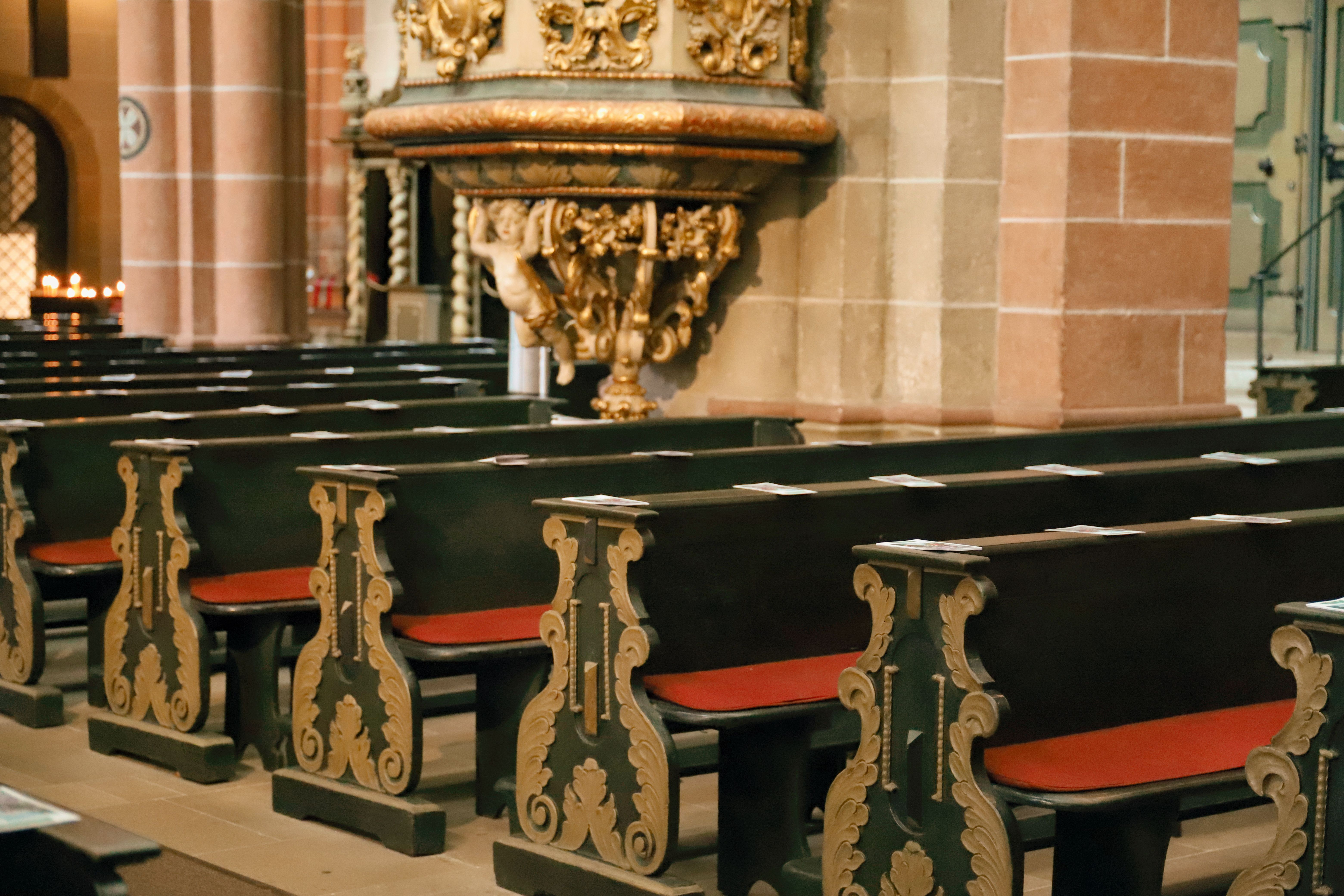 Elegant Church Interior with Ornate Pews · Free Stock Photo