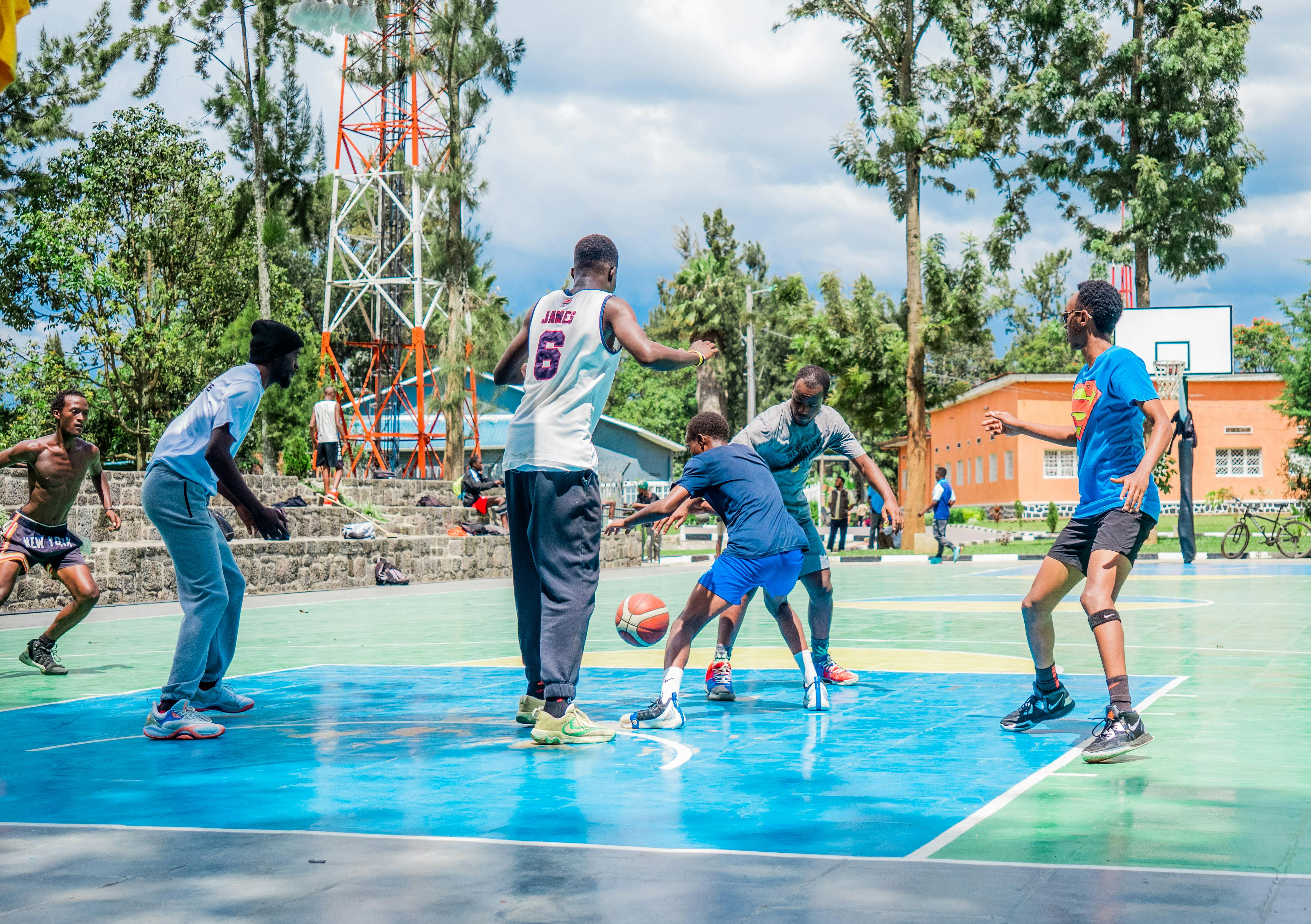 Energetic Outdoor Basketball Game on Sunny Day · Free Stock Photo
