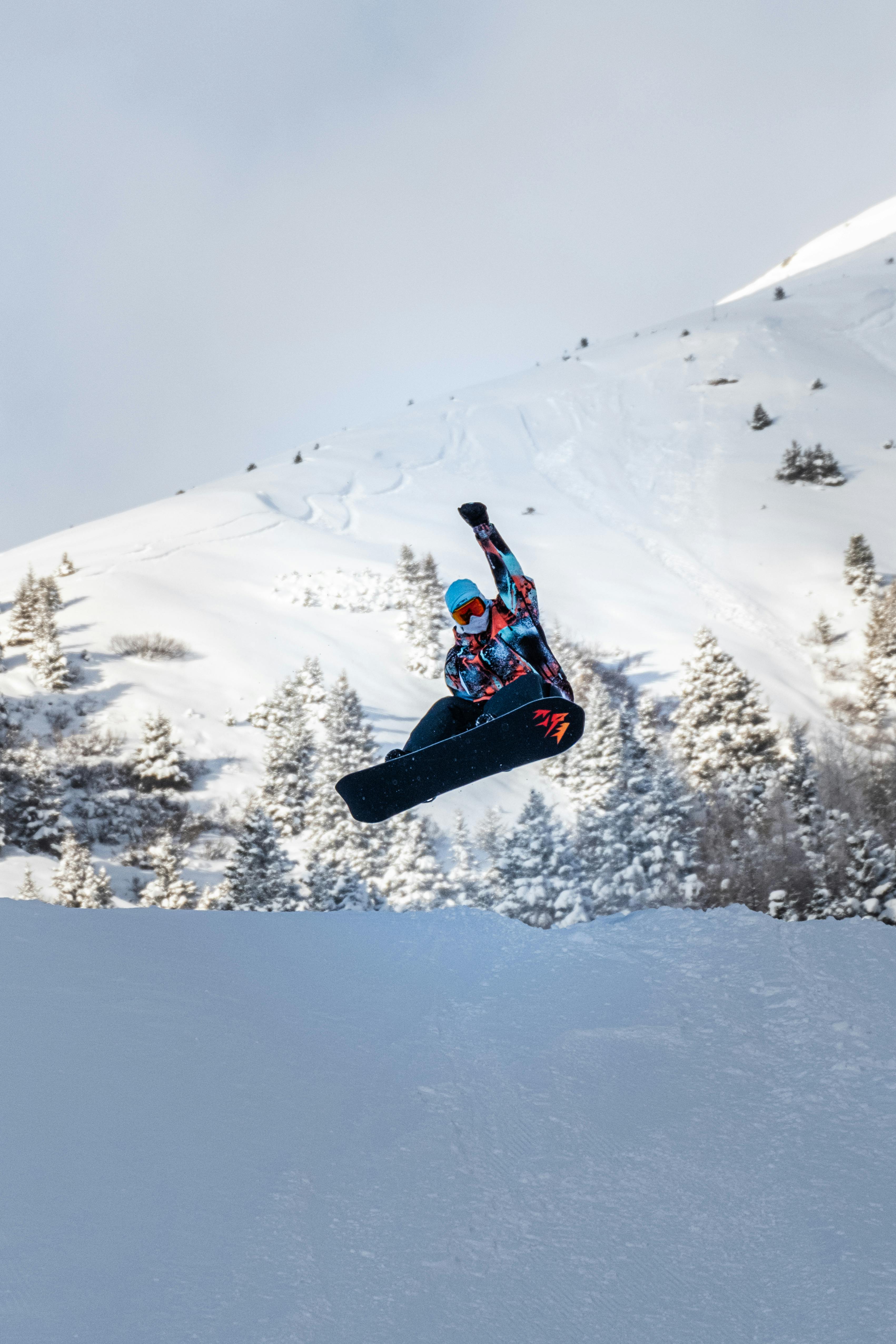 Man In Snowboard Doing A Mid Air Jump · Free Stock Photo