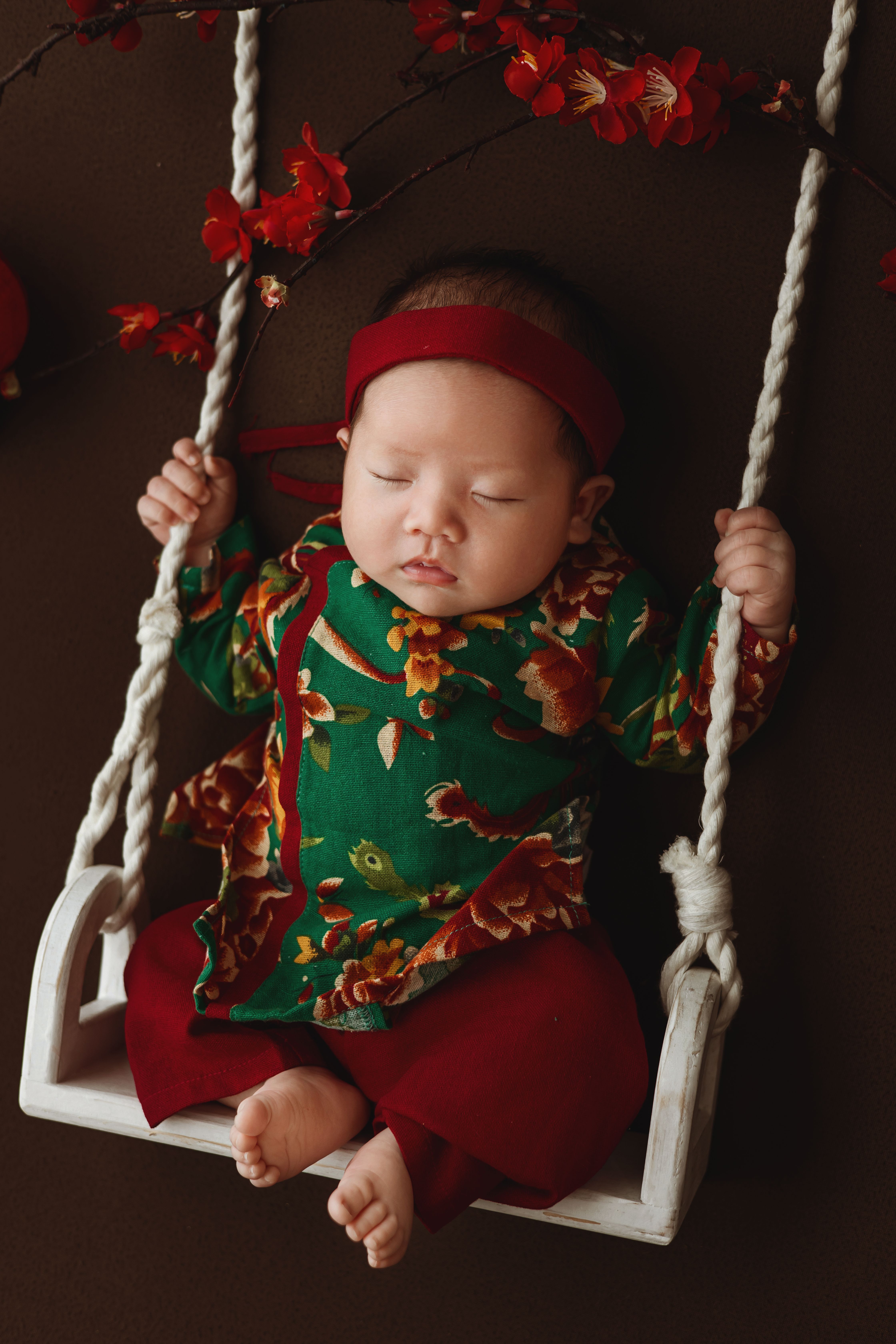 Peaceful Baby in Traditional Vietnamese Attire · Free Stock Photo