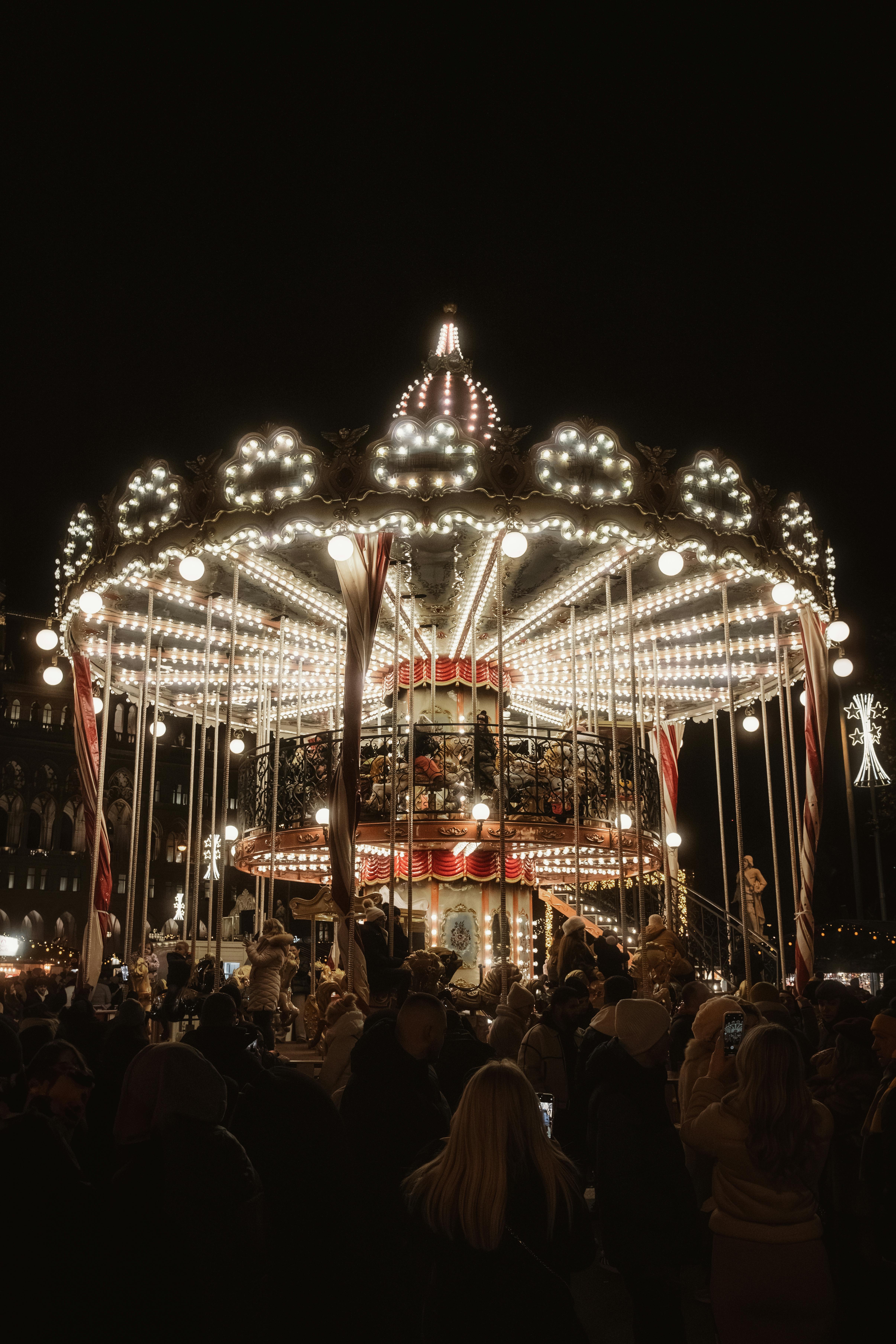 Festive Night Carousel with Illuminated Lights · Free Stock Photo