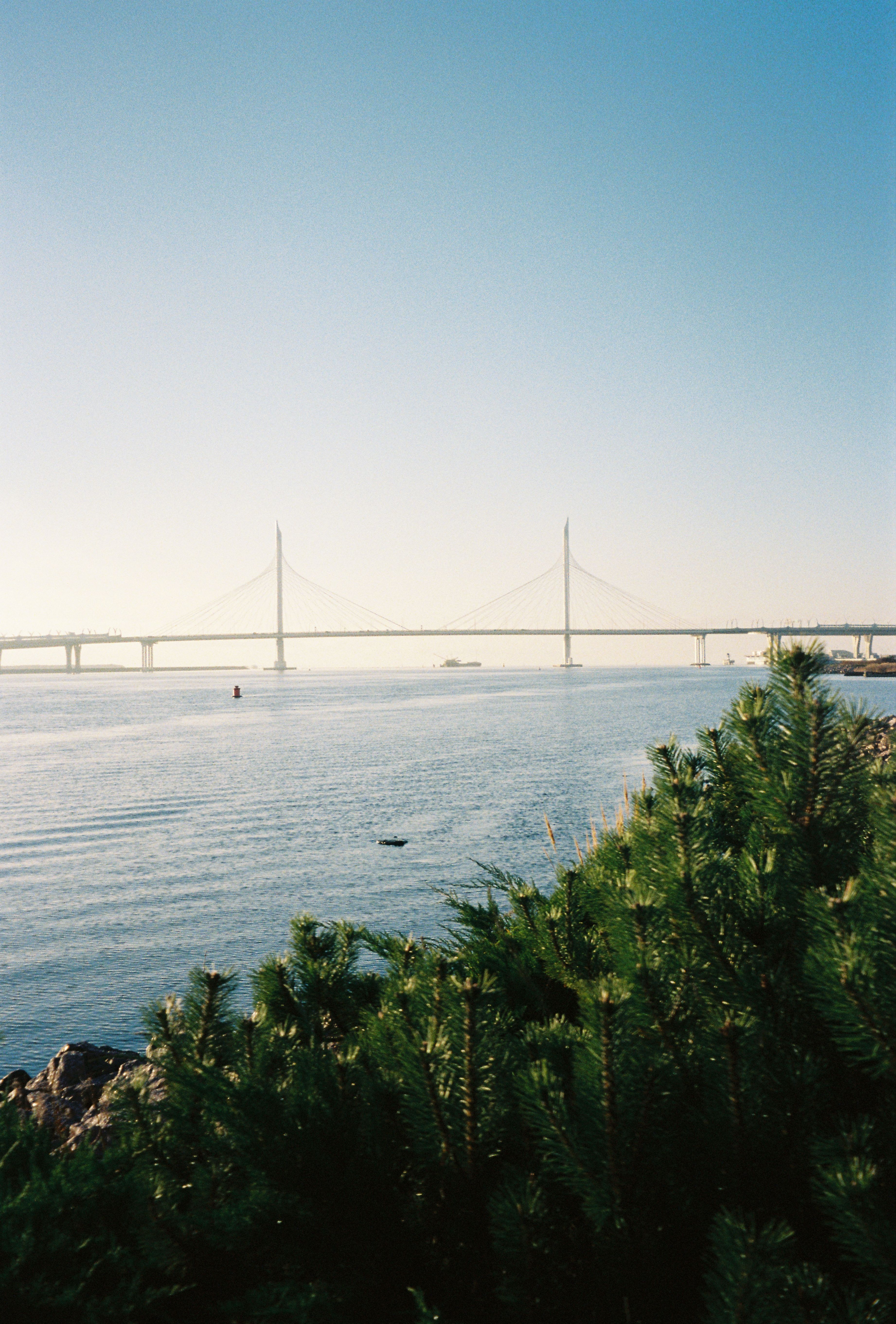 Scenic View of Bridge Over Calm Water at Sunrise · Free Stock Photo