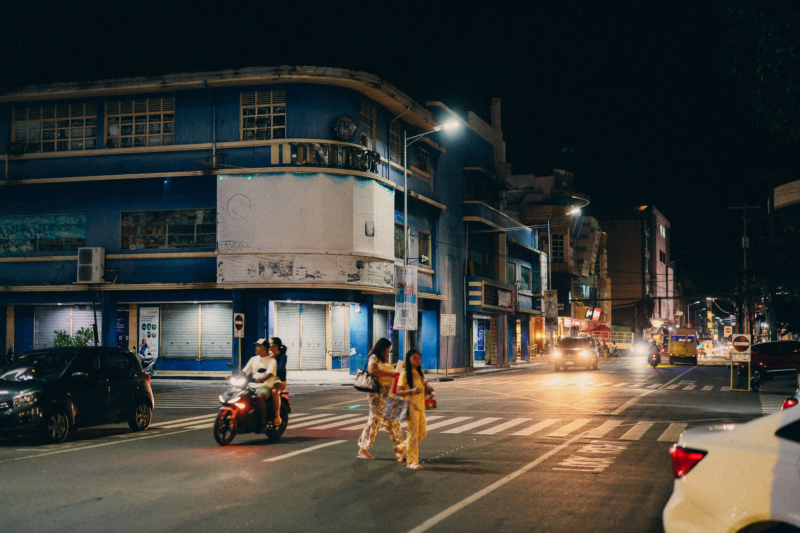 Vibrant Night Life in City Street Crossing · Free Stock Photo