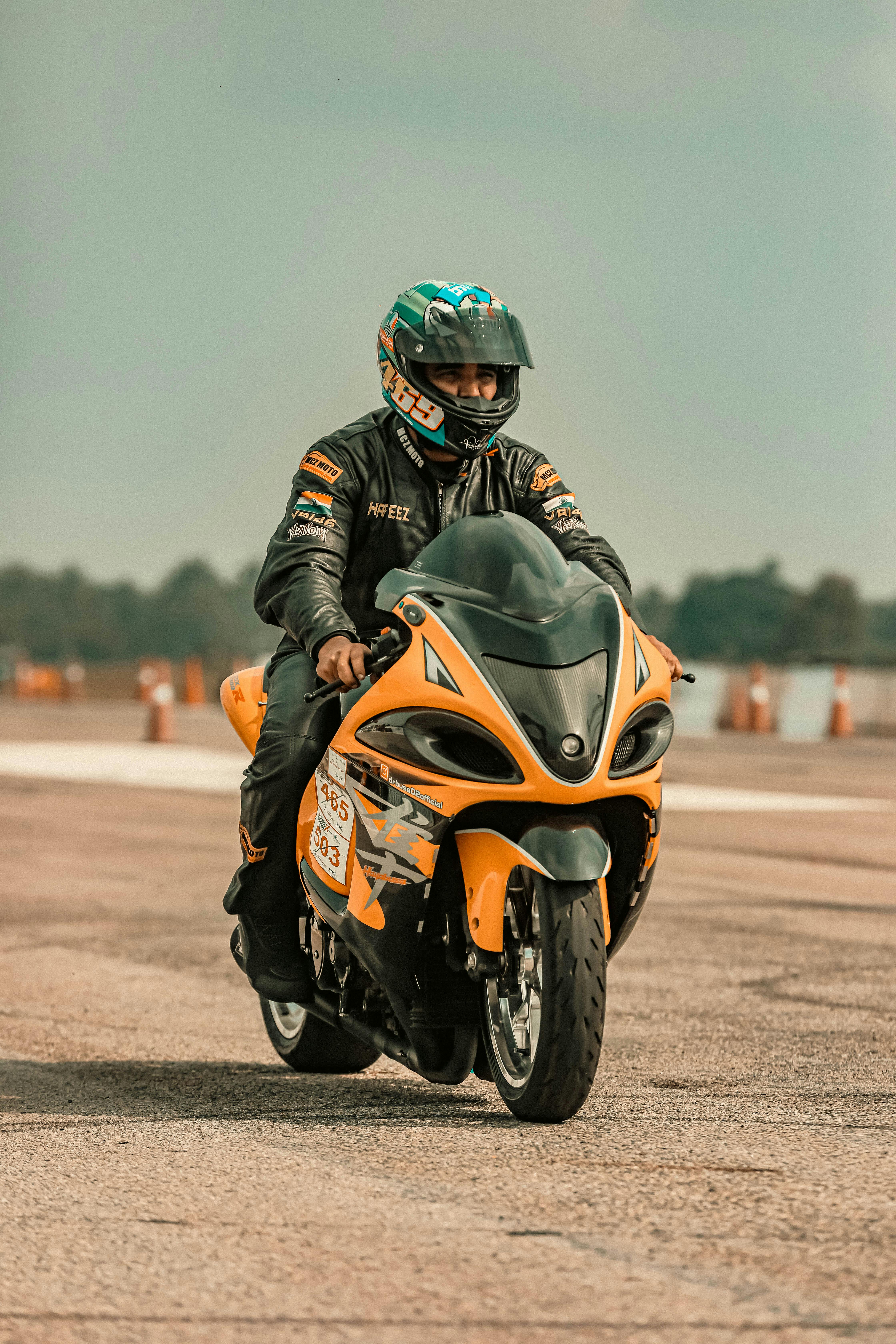 A Racer Riding His Motorcycle in the Race Track · Free Stock Photo