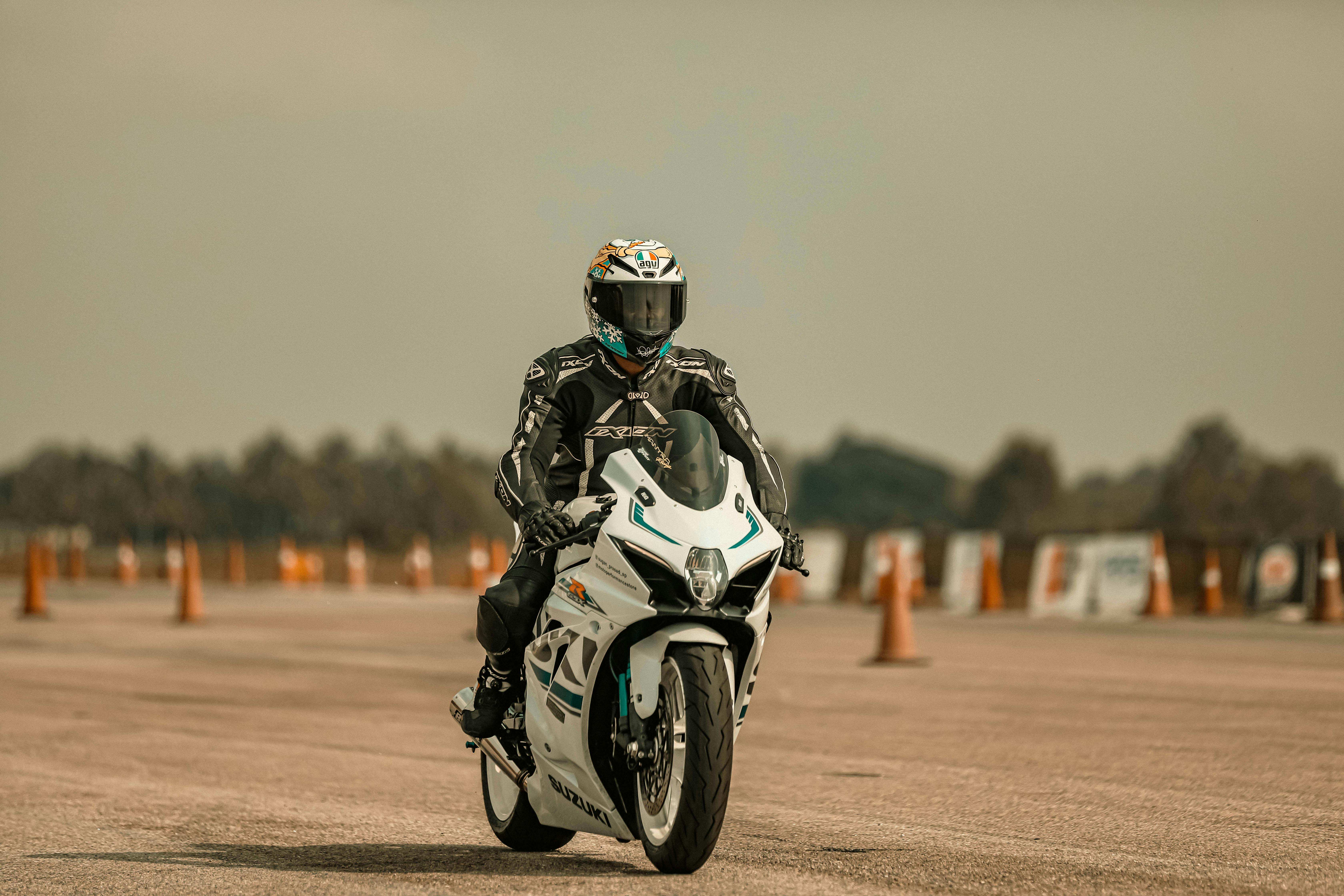 Motorcyclist Racing on Open Track Daytime · Free Stock Photo