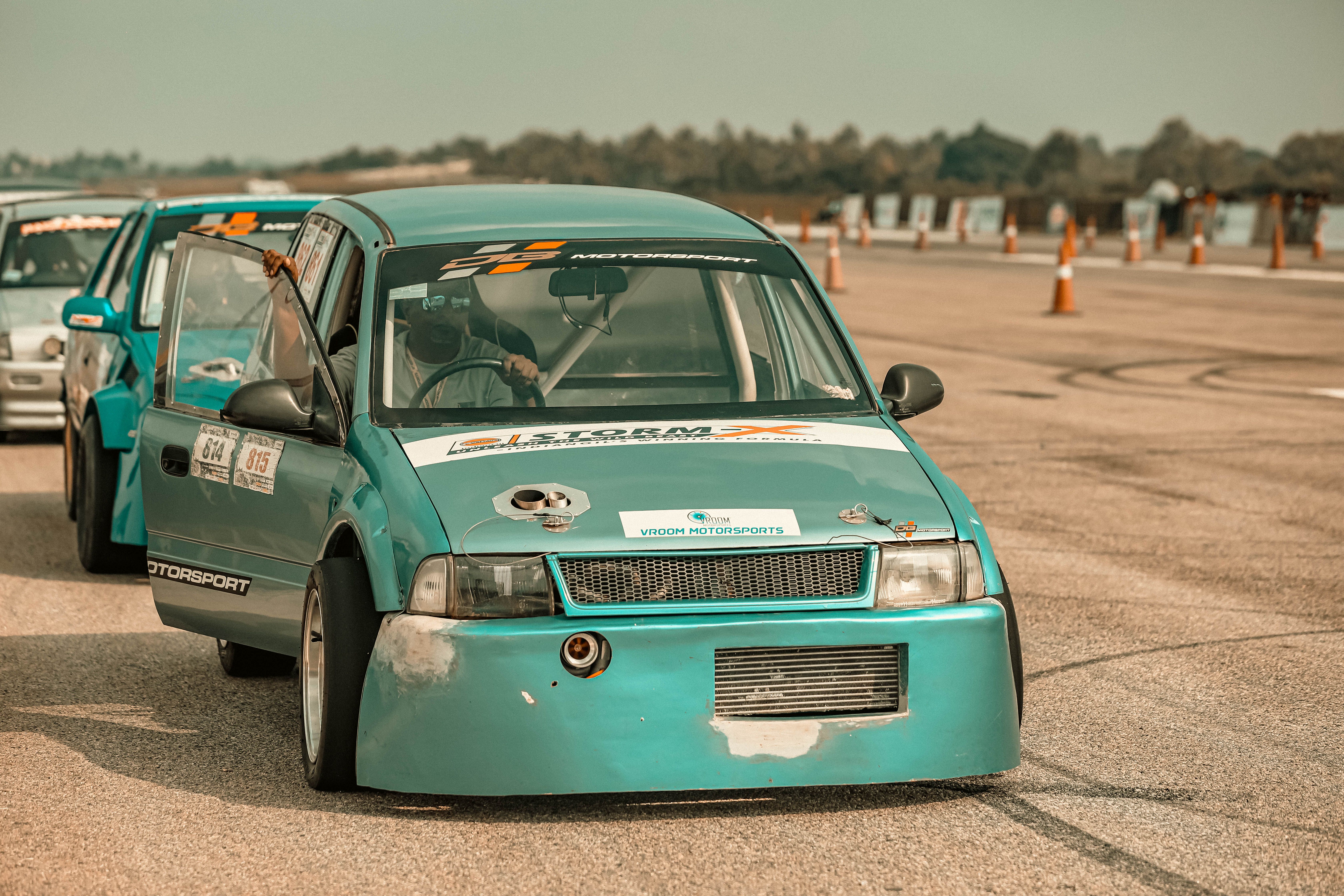 Exciting Stock Car Racing on an Open Track · Free Stock Photo