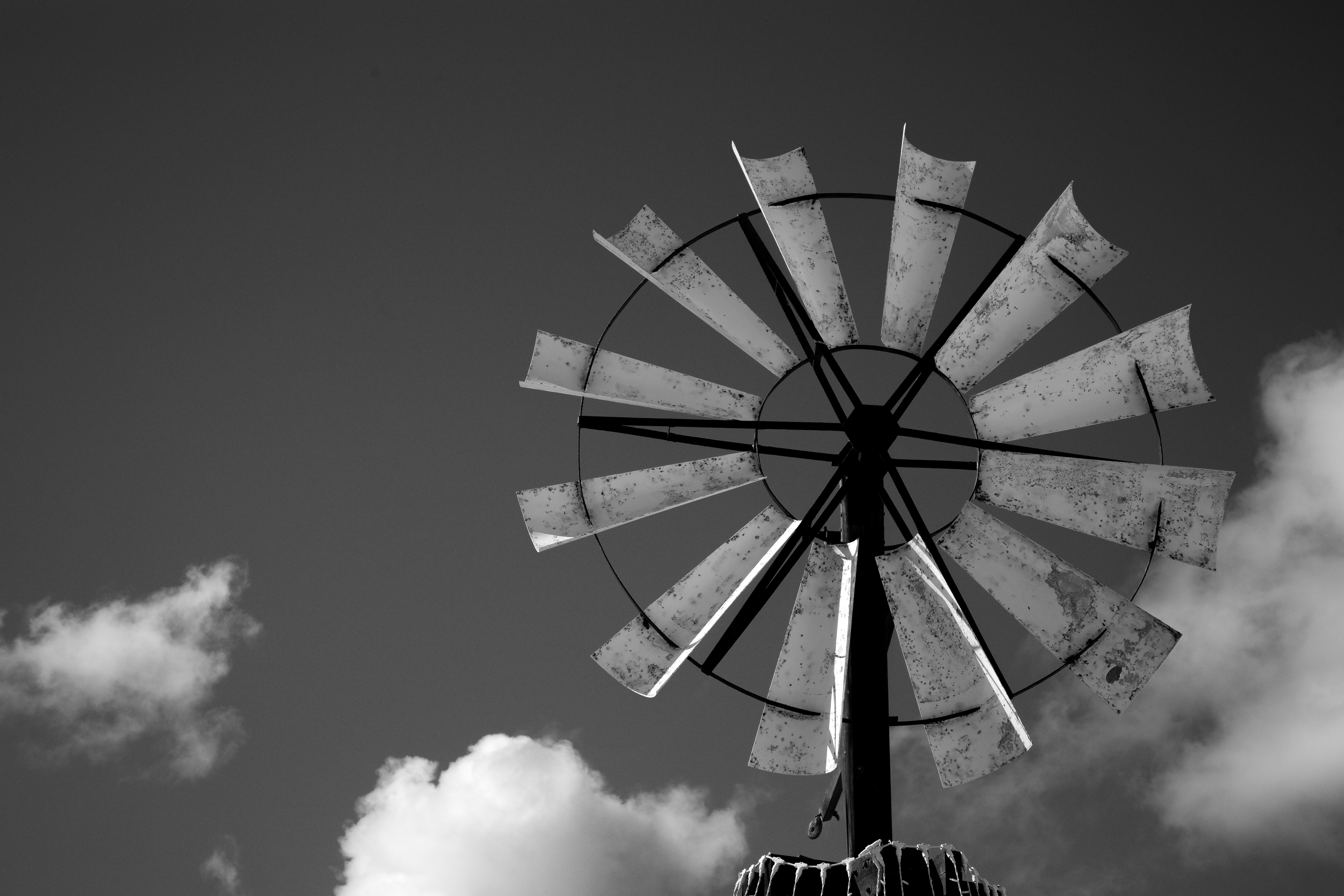 Black and White Windmill Against Cloudy Sky · Free Stock Photo