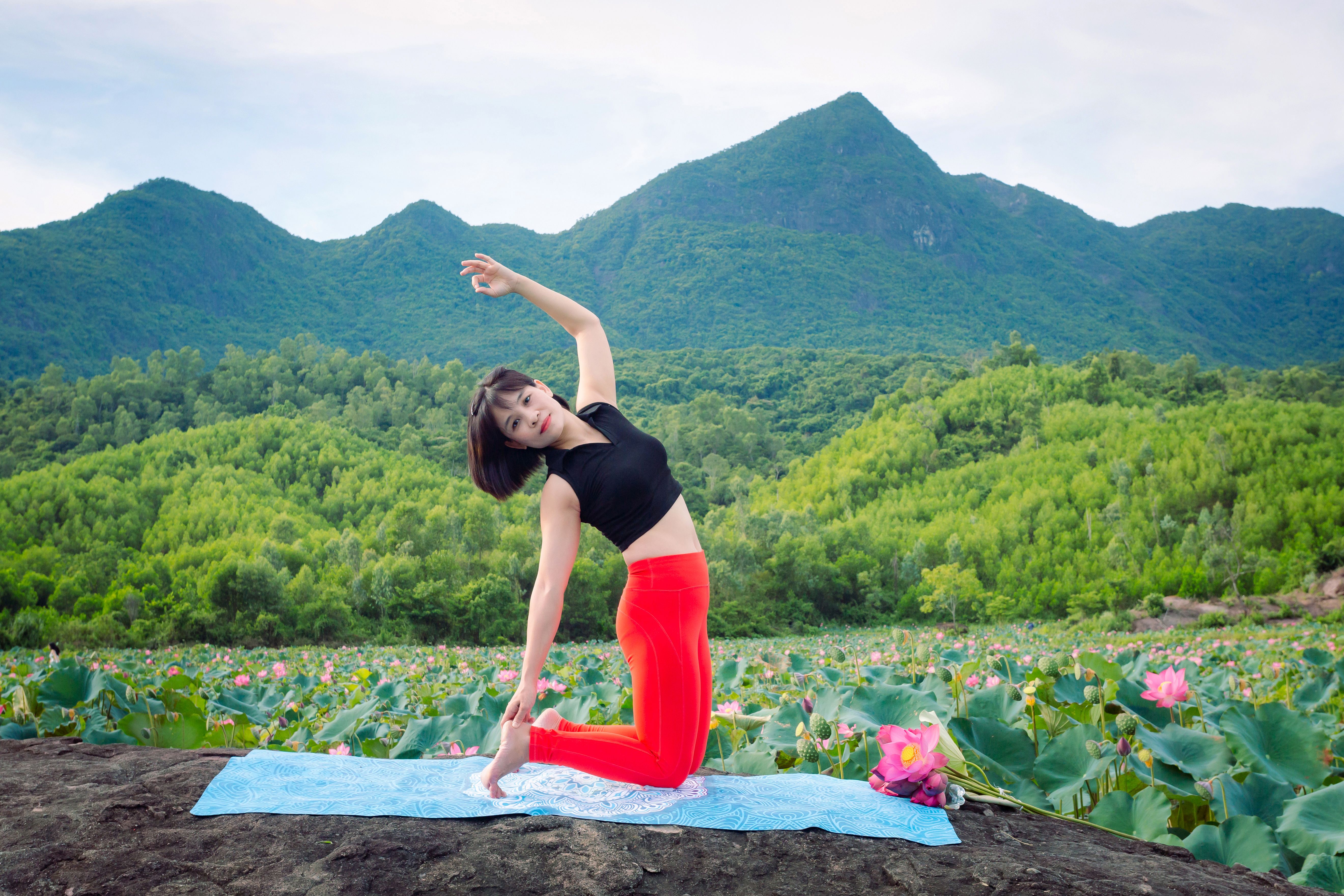 Dynamic Yoga Pose in Lotus Field, Hội An · Free Stock Photo
